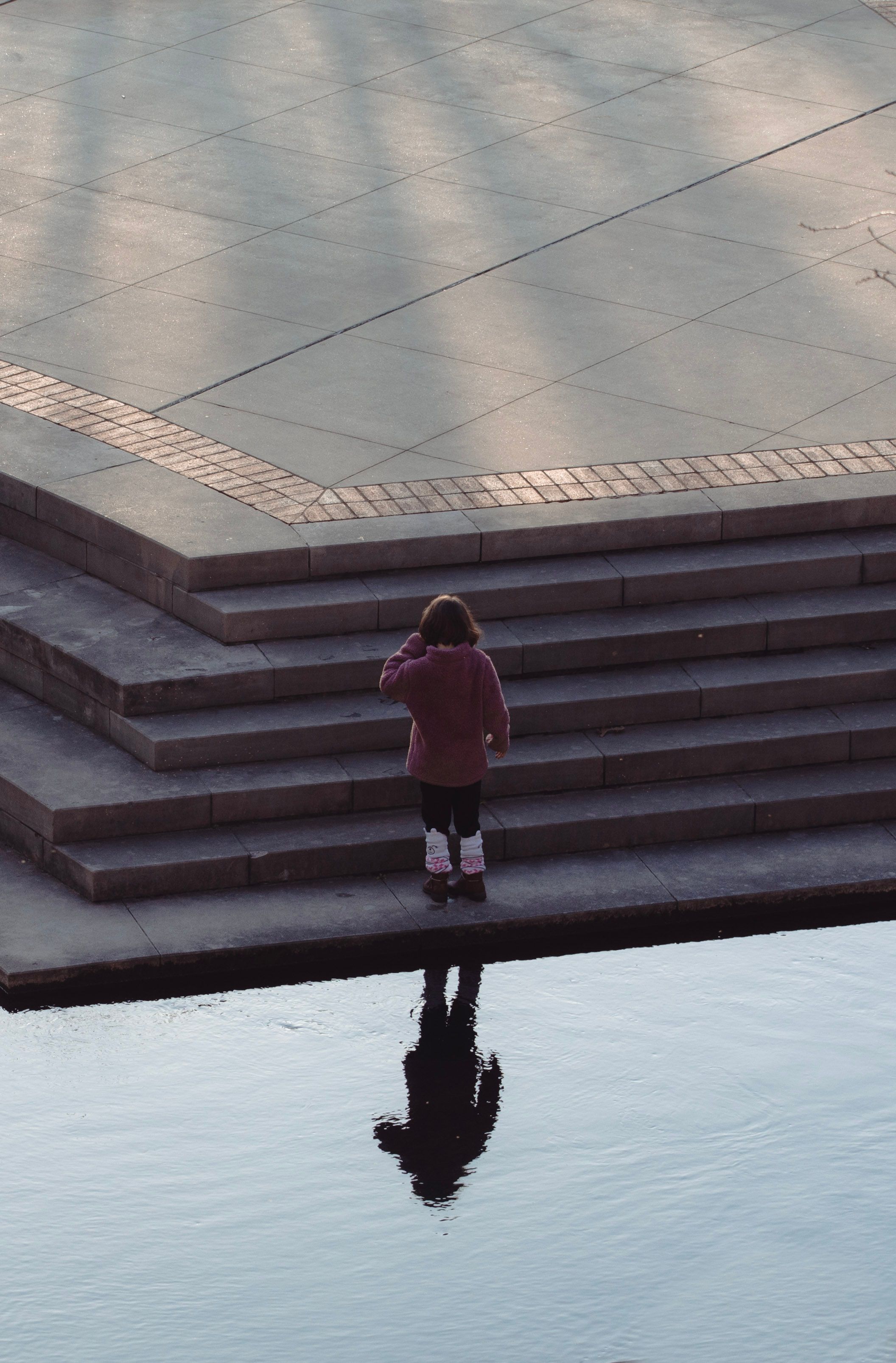 Girl Standing on Stairs on Square · Free Stock Photo