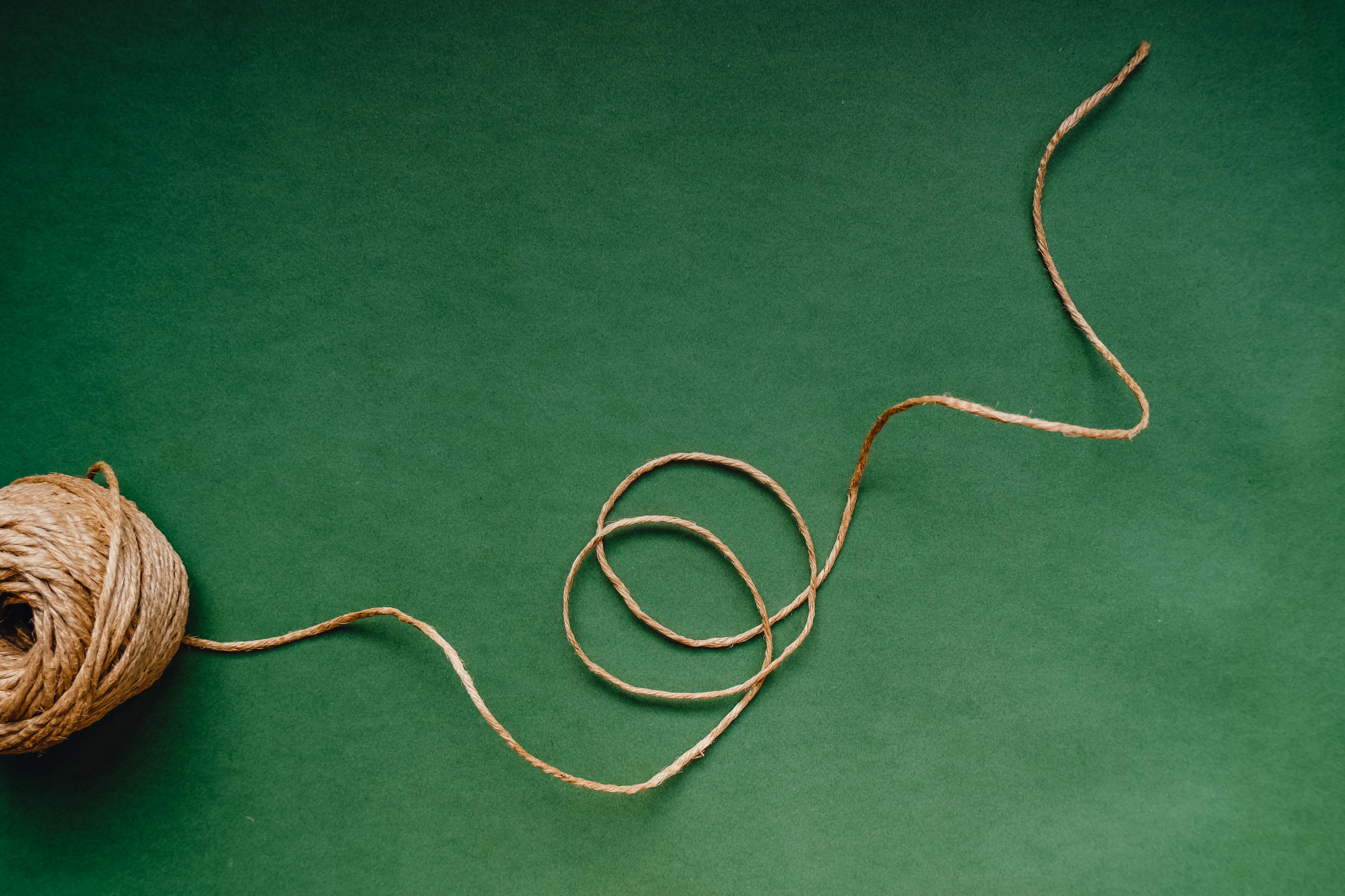 Brown Spool Of Rope on Gray Concrete Floor · Free Stock Photo
