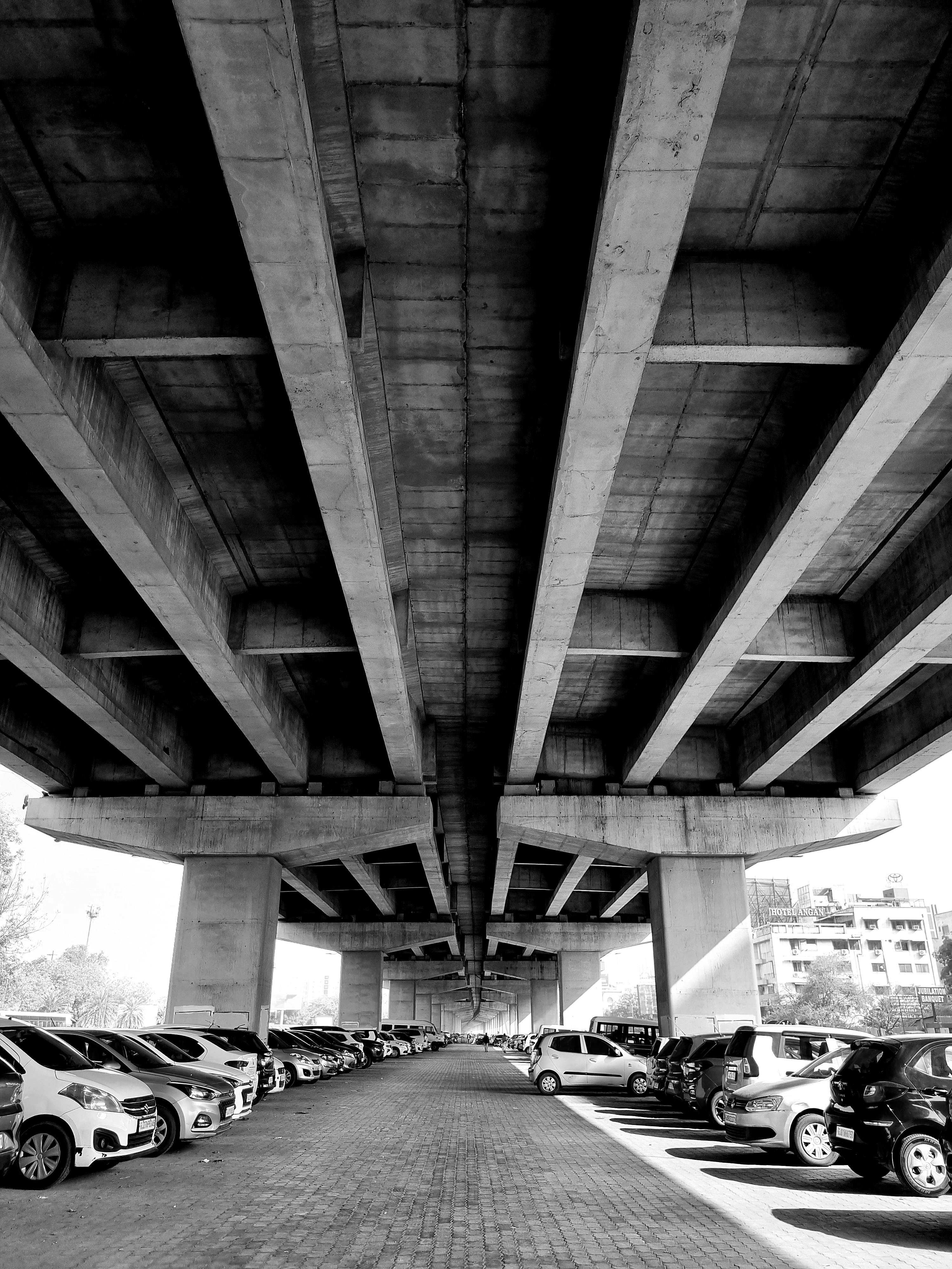 Parking Lot under a Bridge · Free Stock Photo