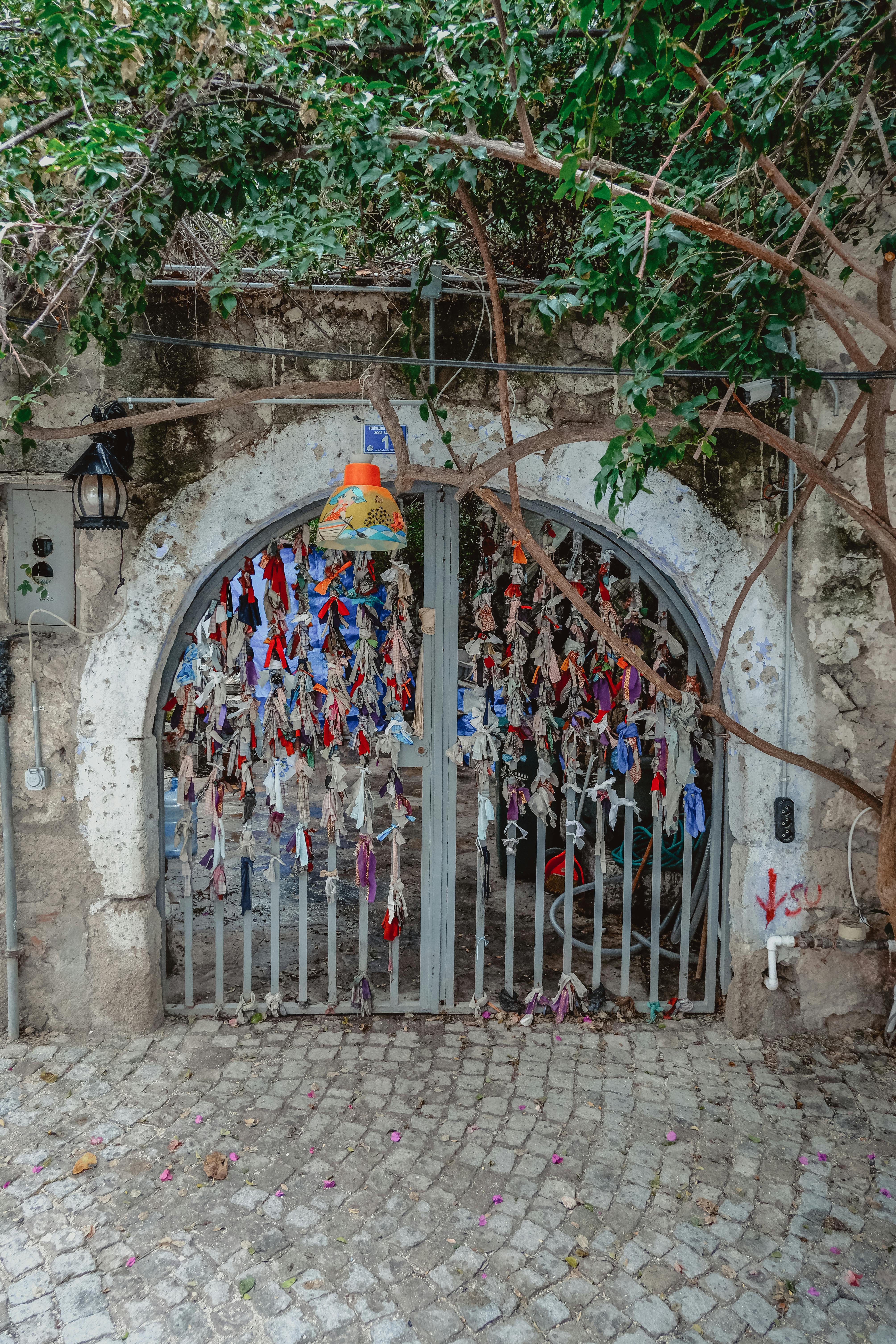 Fabric Strings Hanging on the Gate · Free Stock Photo