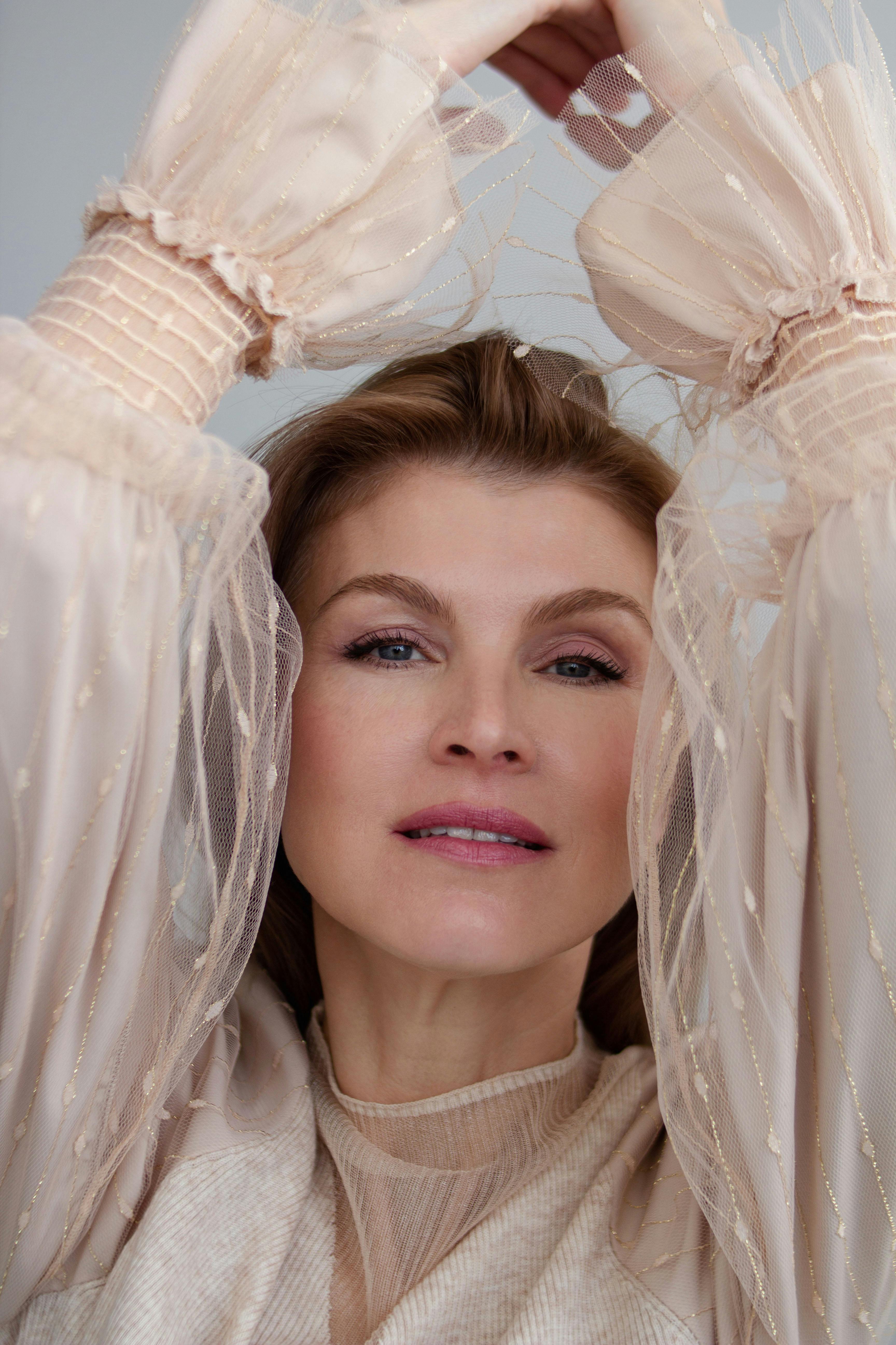 Face of Woman with Arms Raised · Free Stock Photo