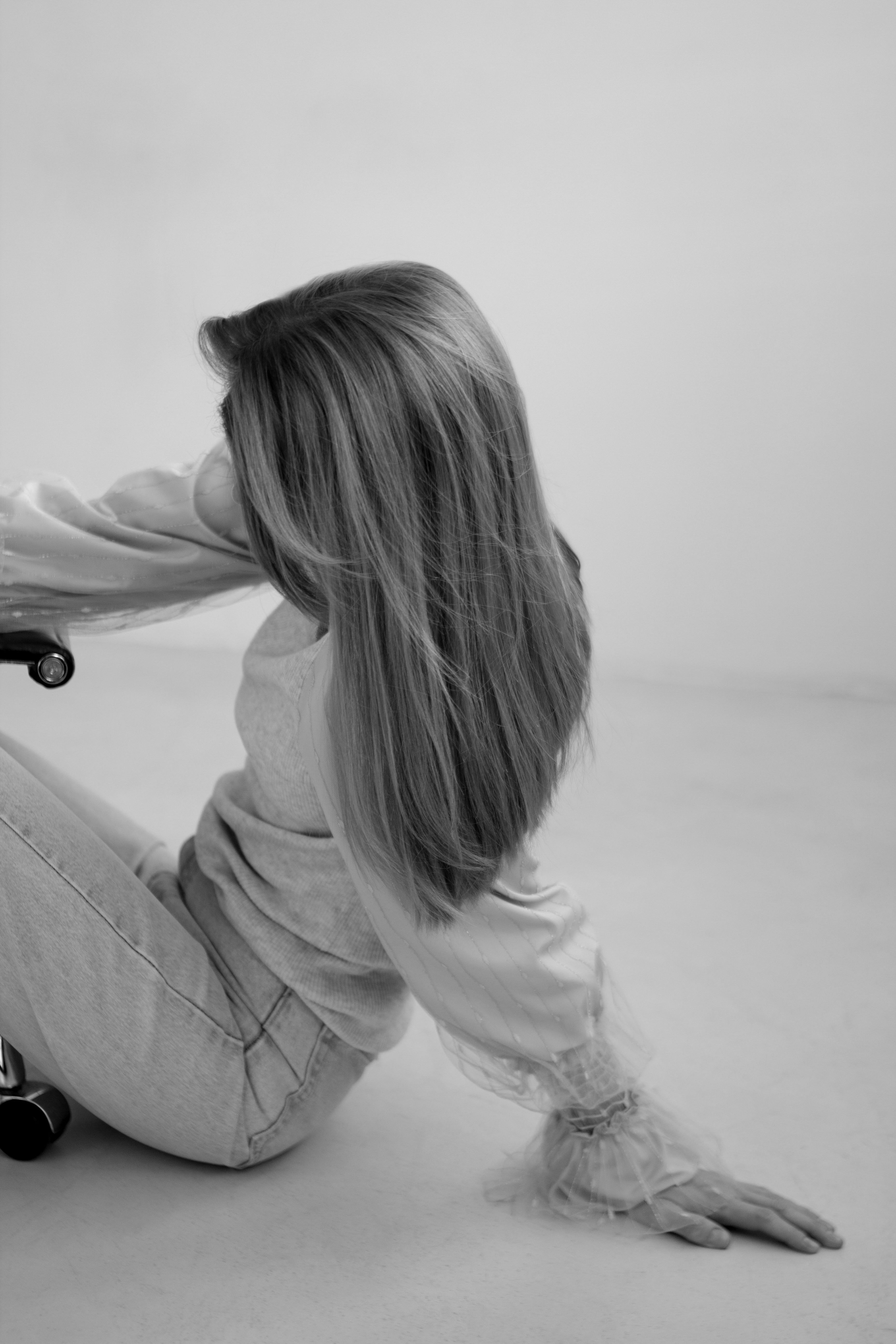 Sitting Woman in Black and White · Free Stock Photo