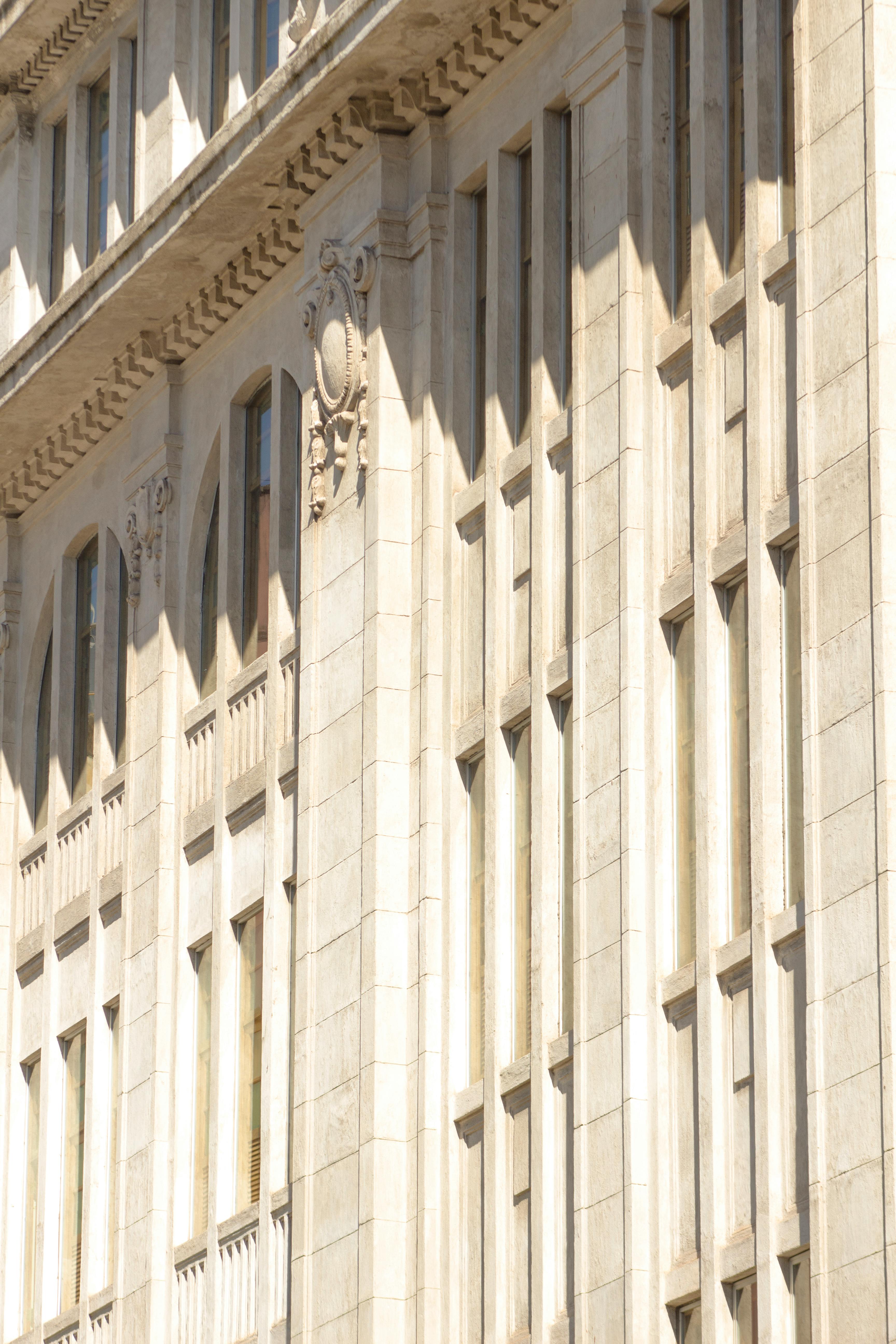 Neoclassical Facade with Windows and Columns · Free Stock Photo