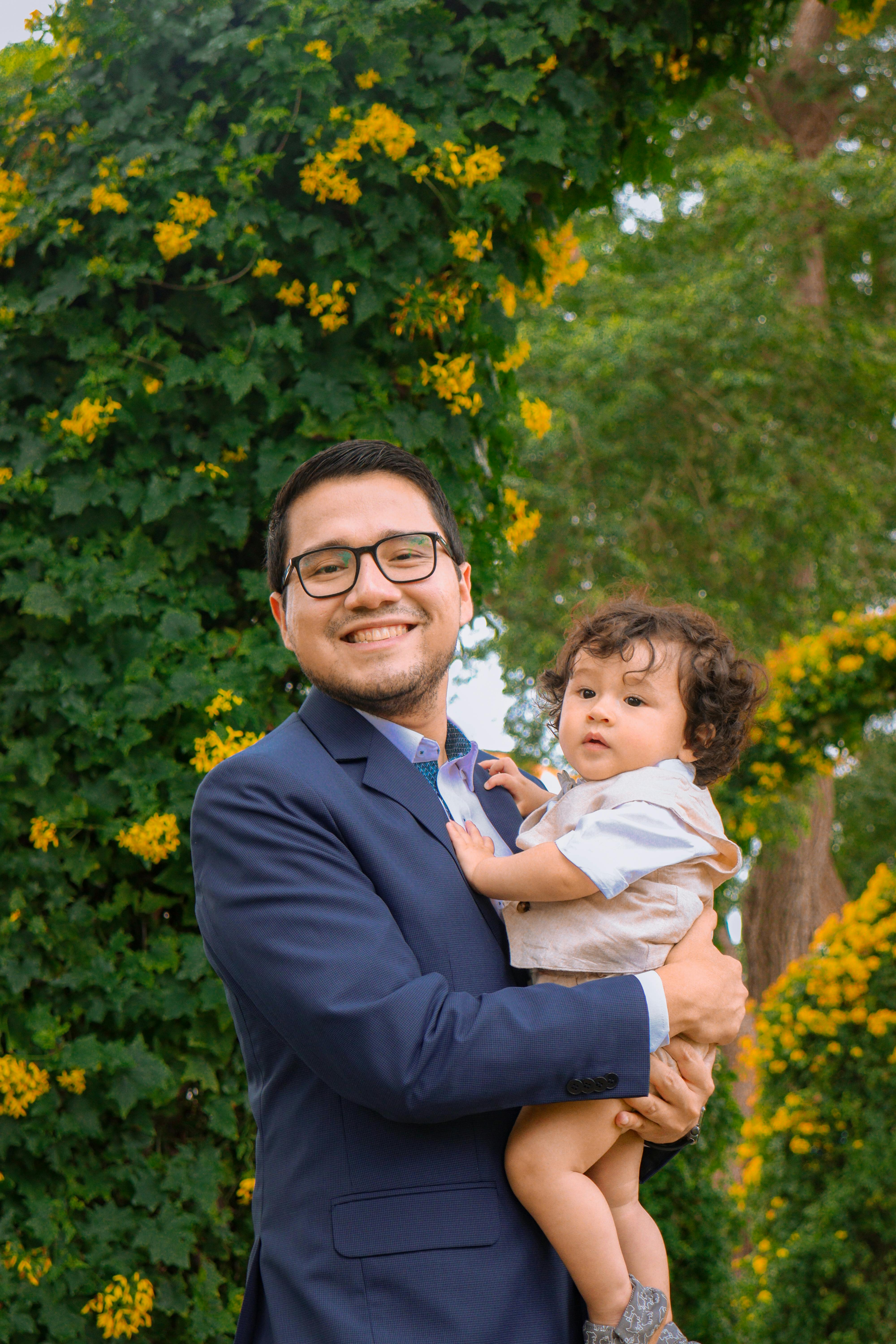 Child in Father Arms · Free Stock Photo