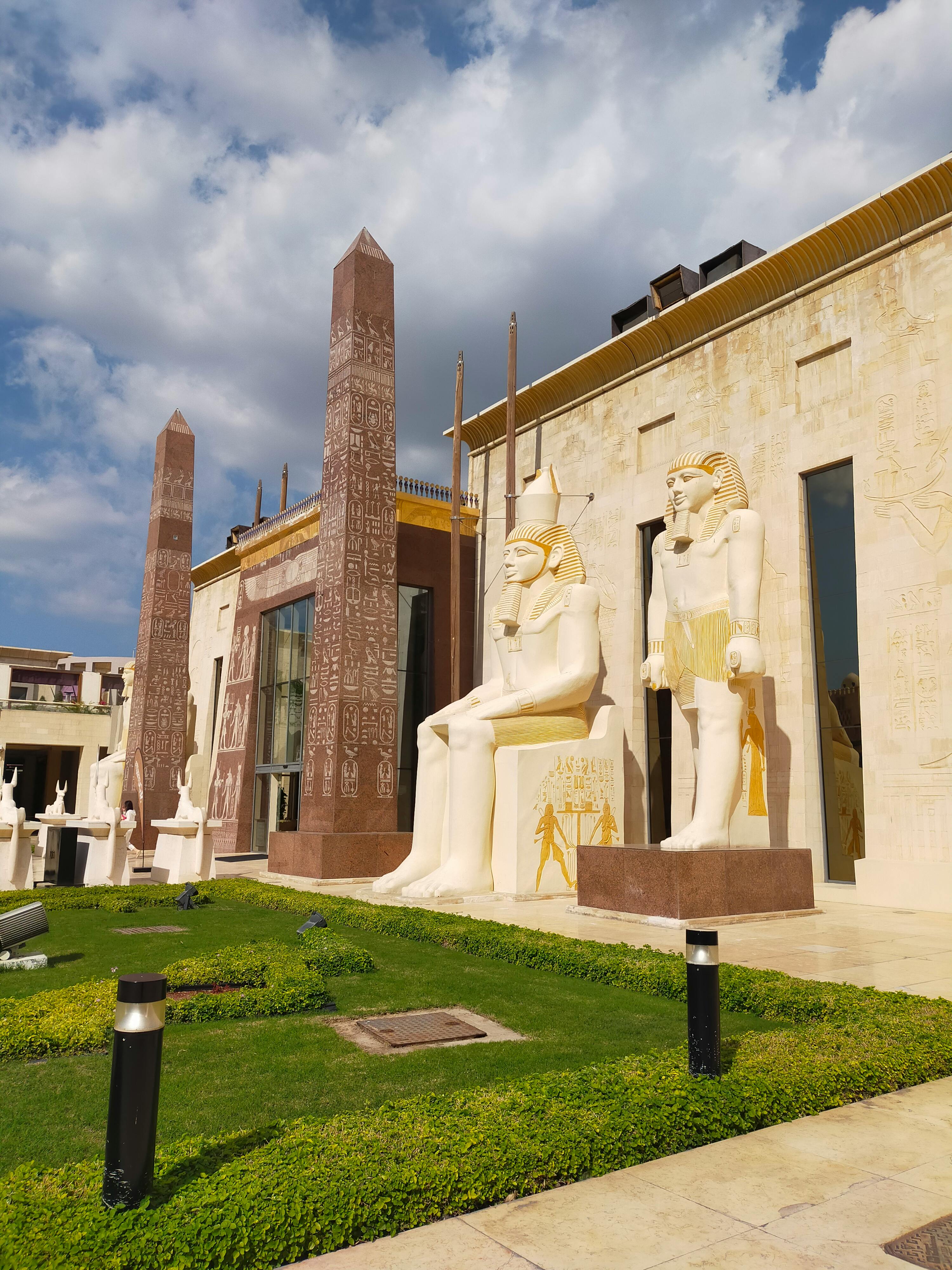 Egyptian Sculptures and Obelisks near Building · Free Stock Photo