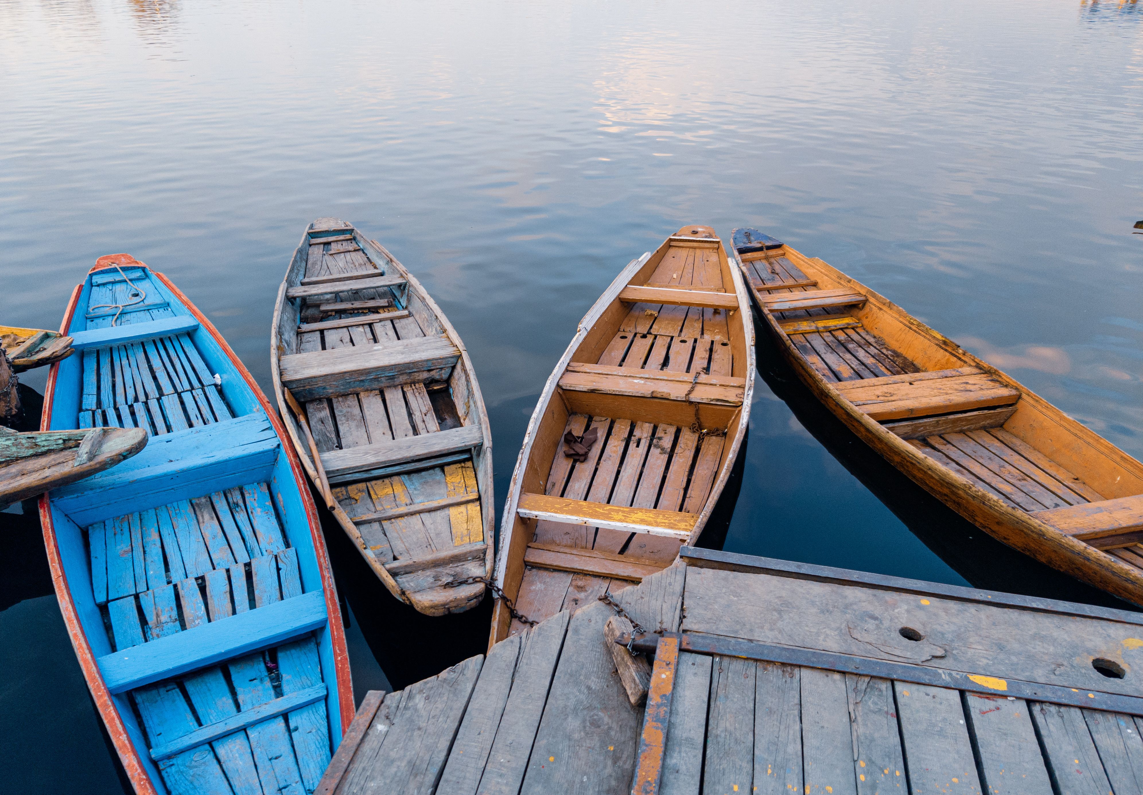 Colorful Boats Moored at a Wooden Dock Pier · Free Stock Photo