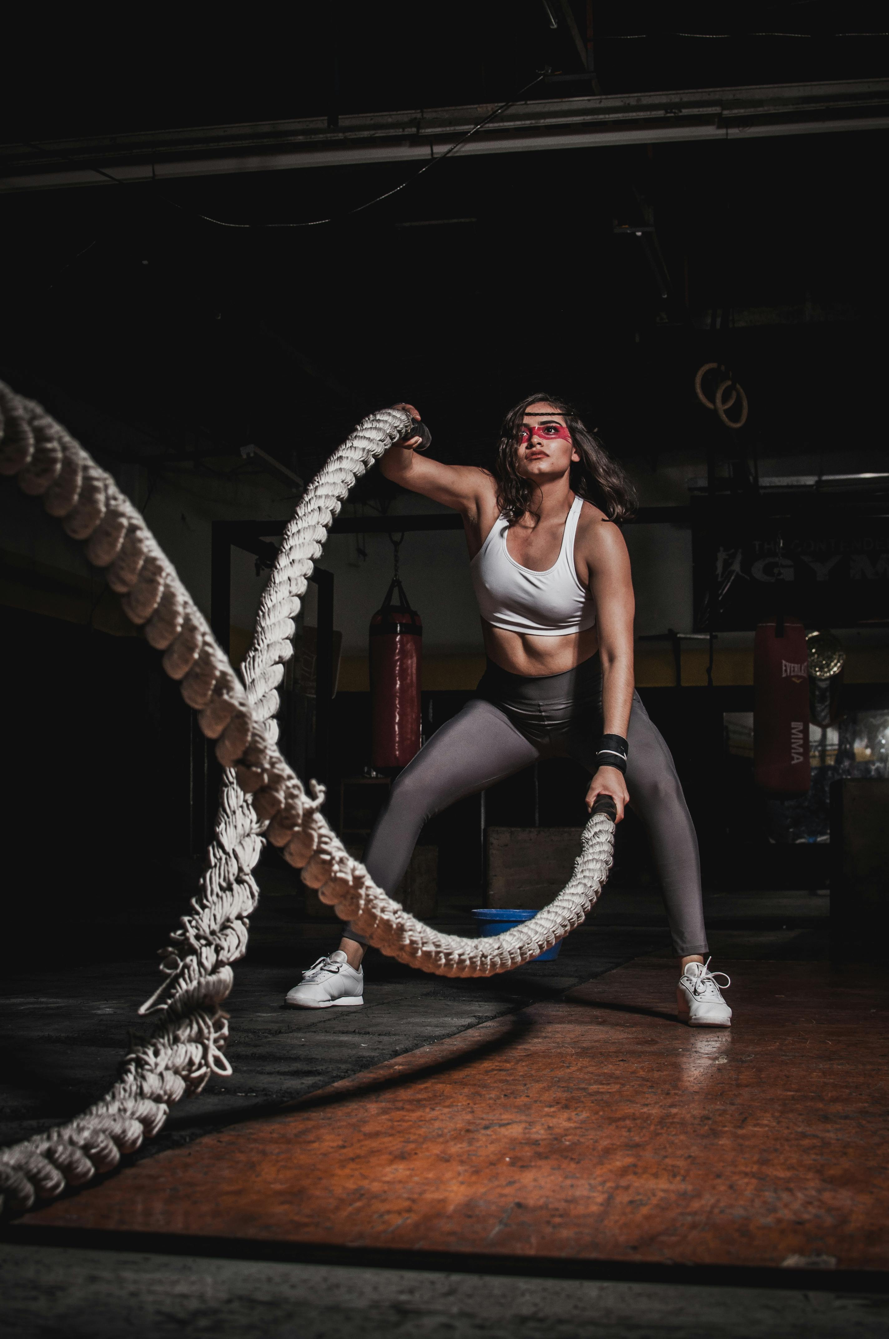 Woman Using Battle Rope · Free Stock Photo