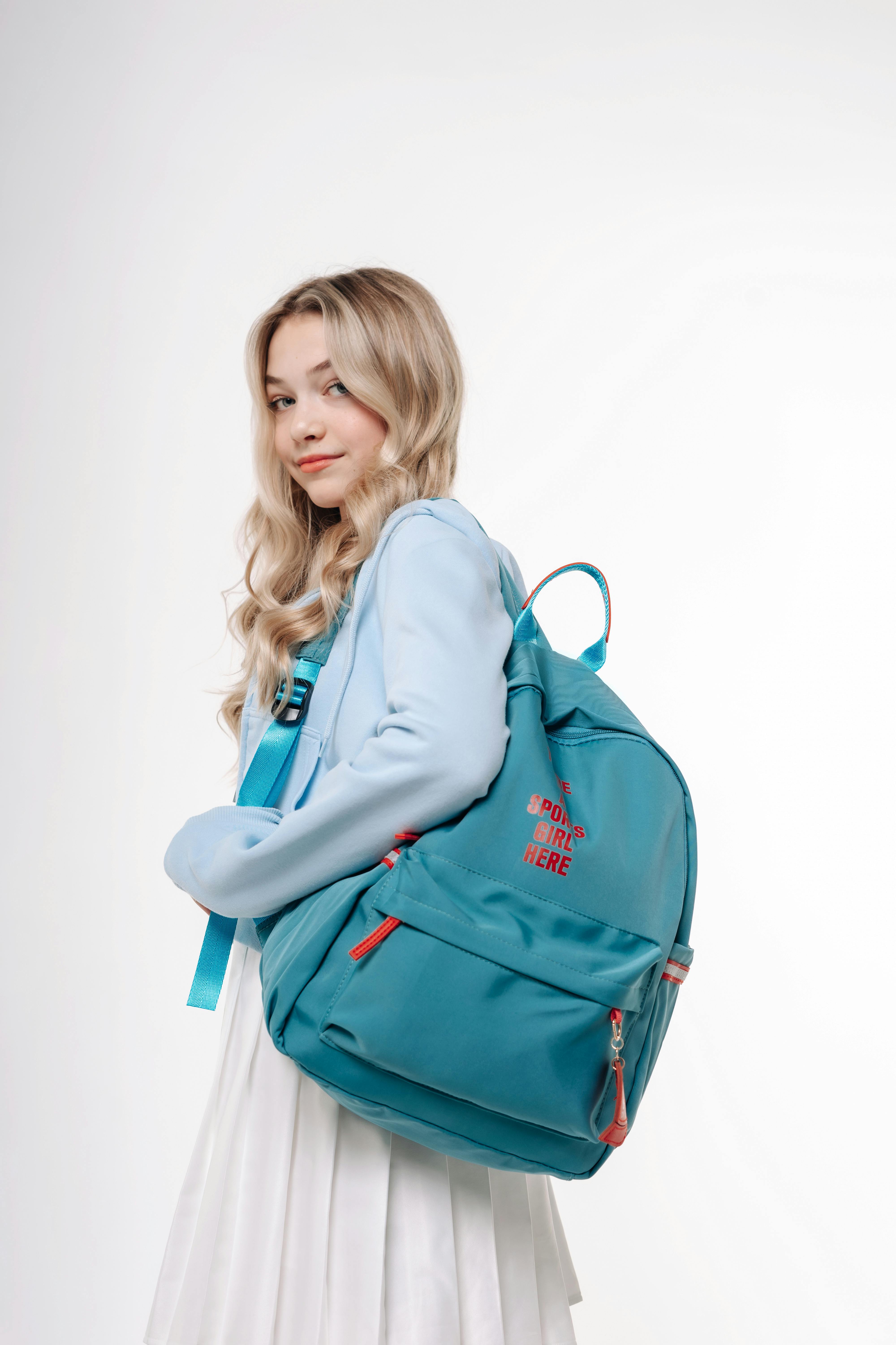 Blonde Woman Posing with Backpack · Free Stock Photo