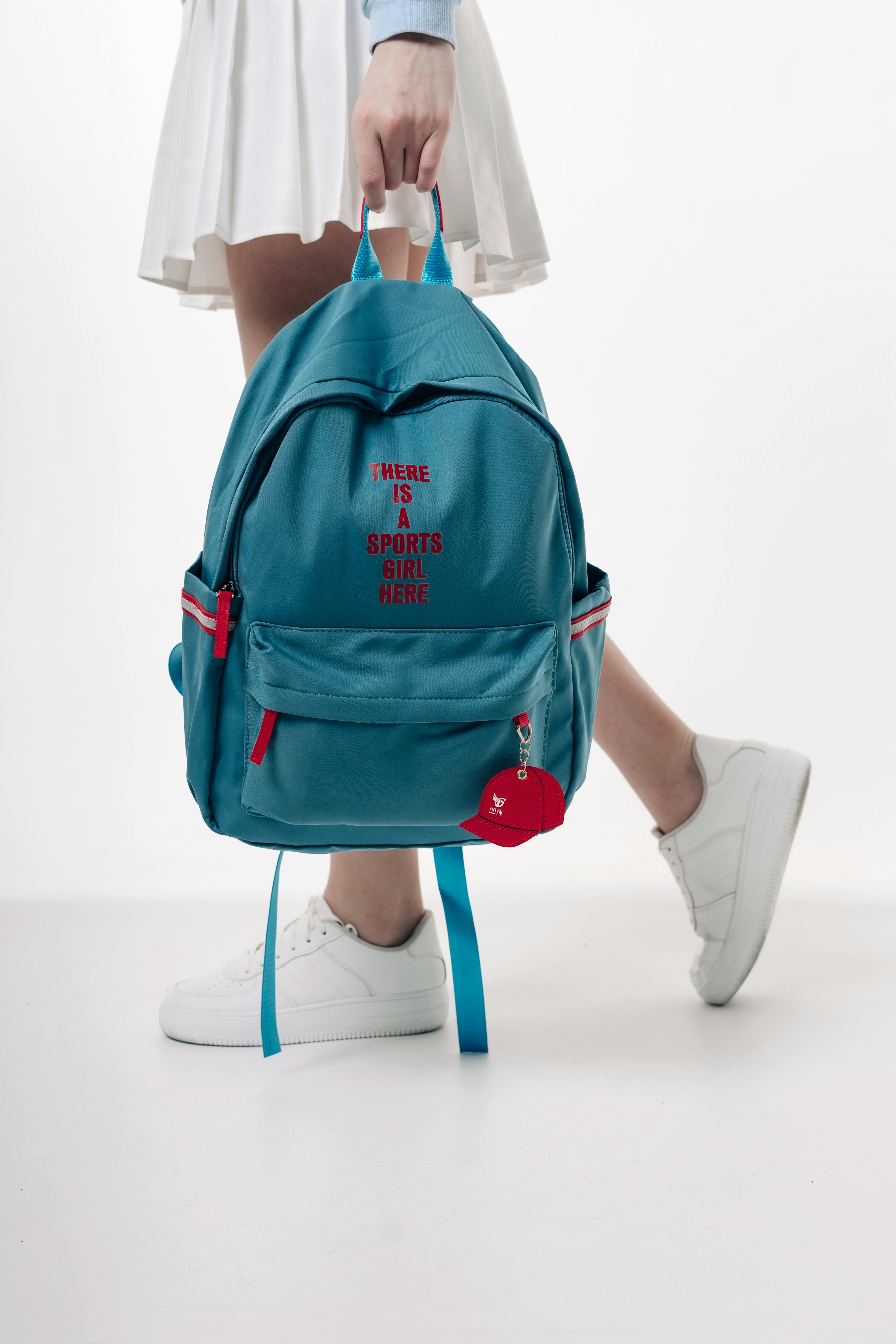 Girl Carrying a Backpack · Free Stock Photo