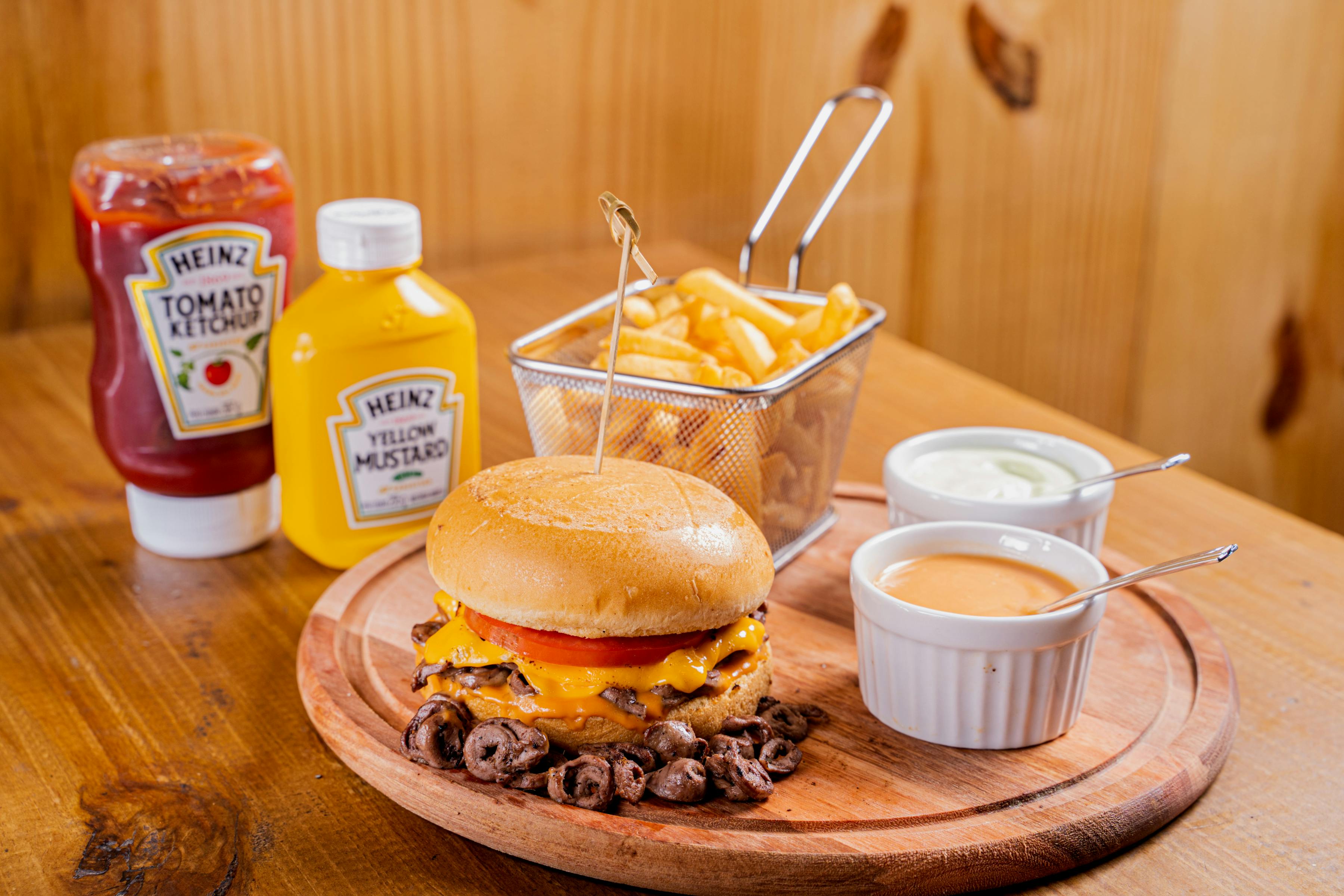 Photo of French Fries, a Cocktail and Bowls with Sauces · Free Stock Photo