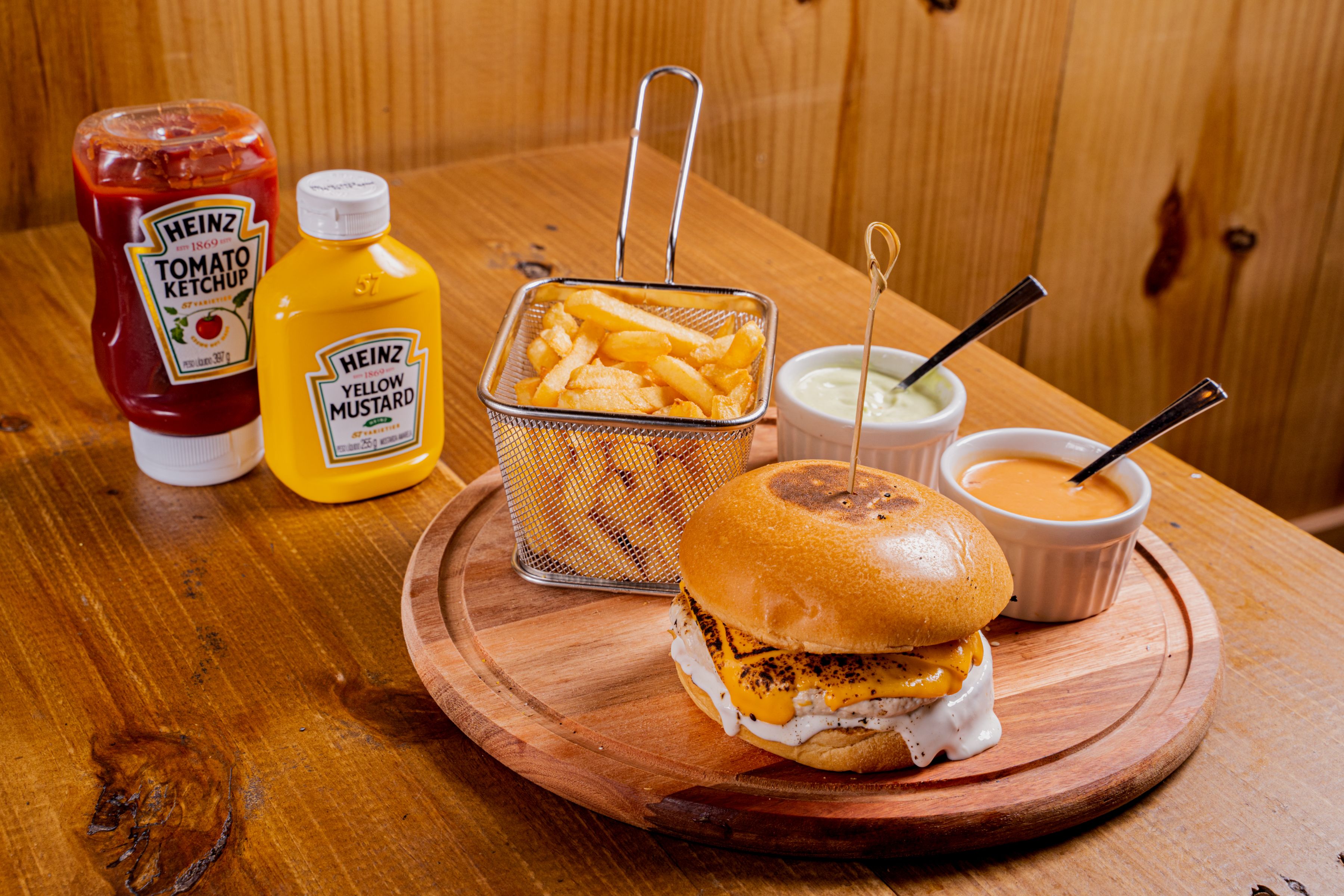 Photo of French Fries, a Cocktail and Bowls with Sauces · Free Stock Photo