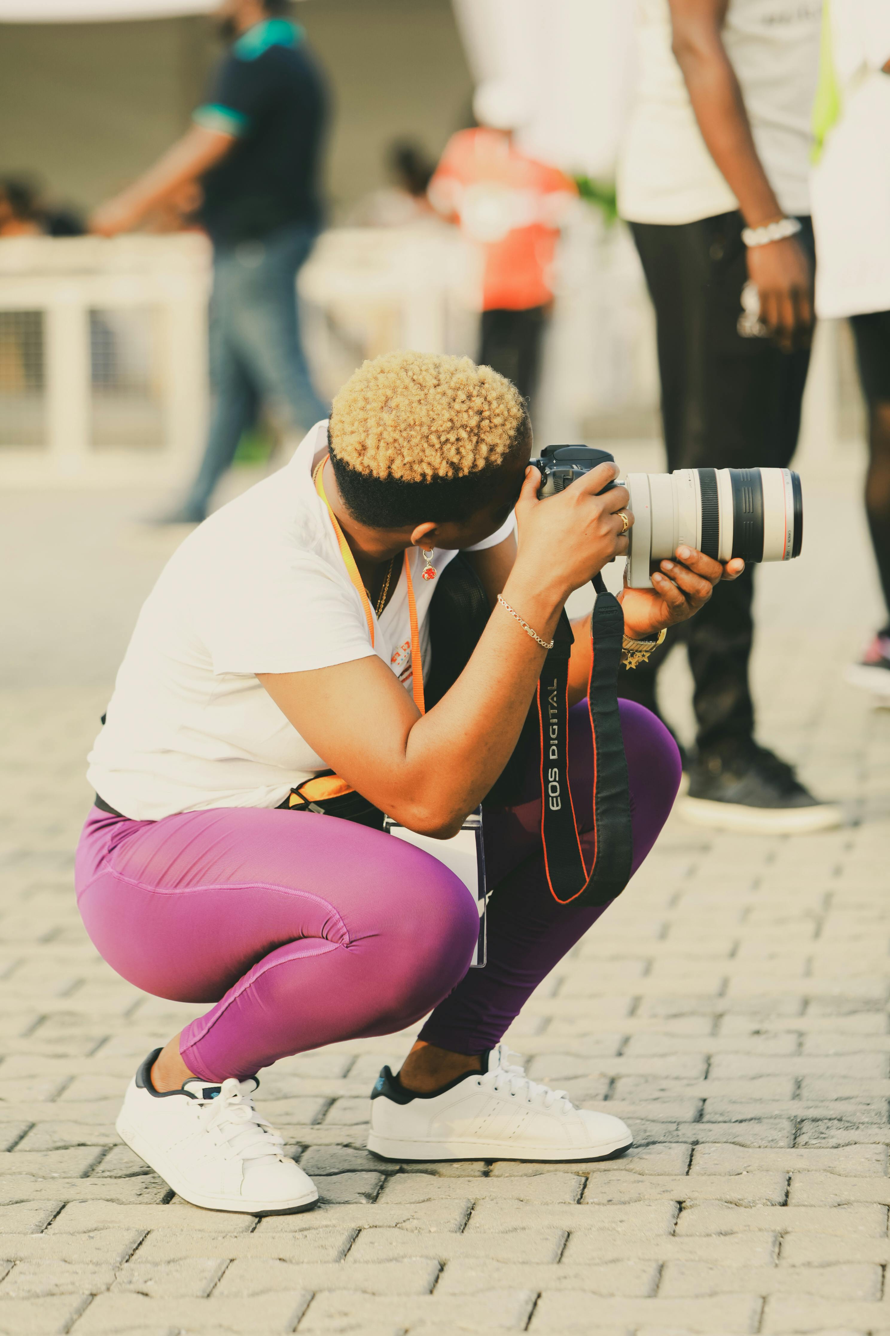 Woman Photographing on a Street · Free Stock Photo