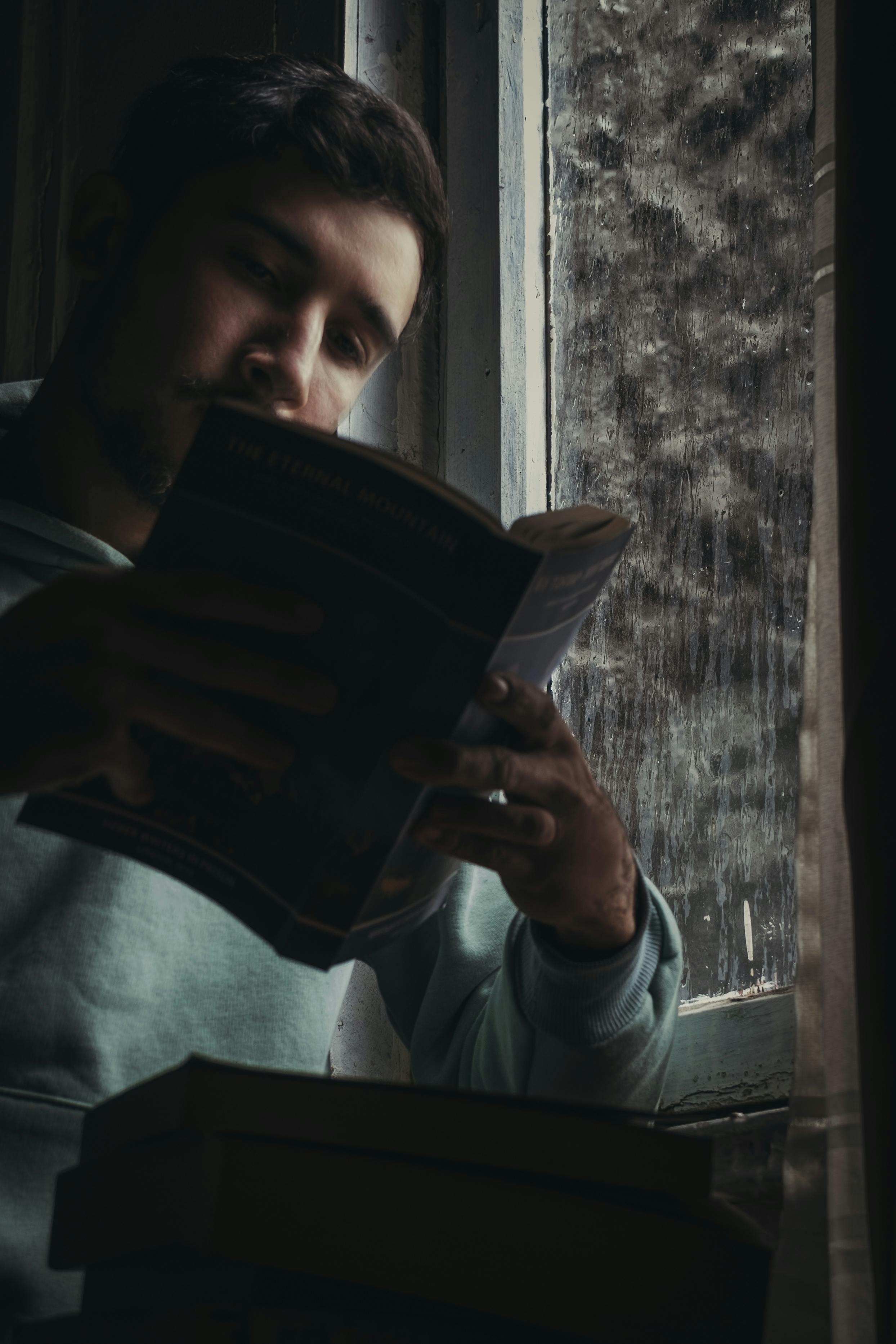 Man Reading Book by Window · Free Stock Photo