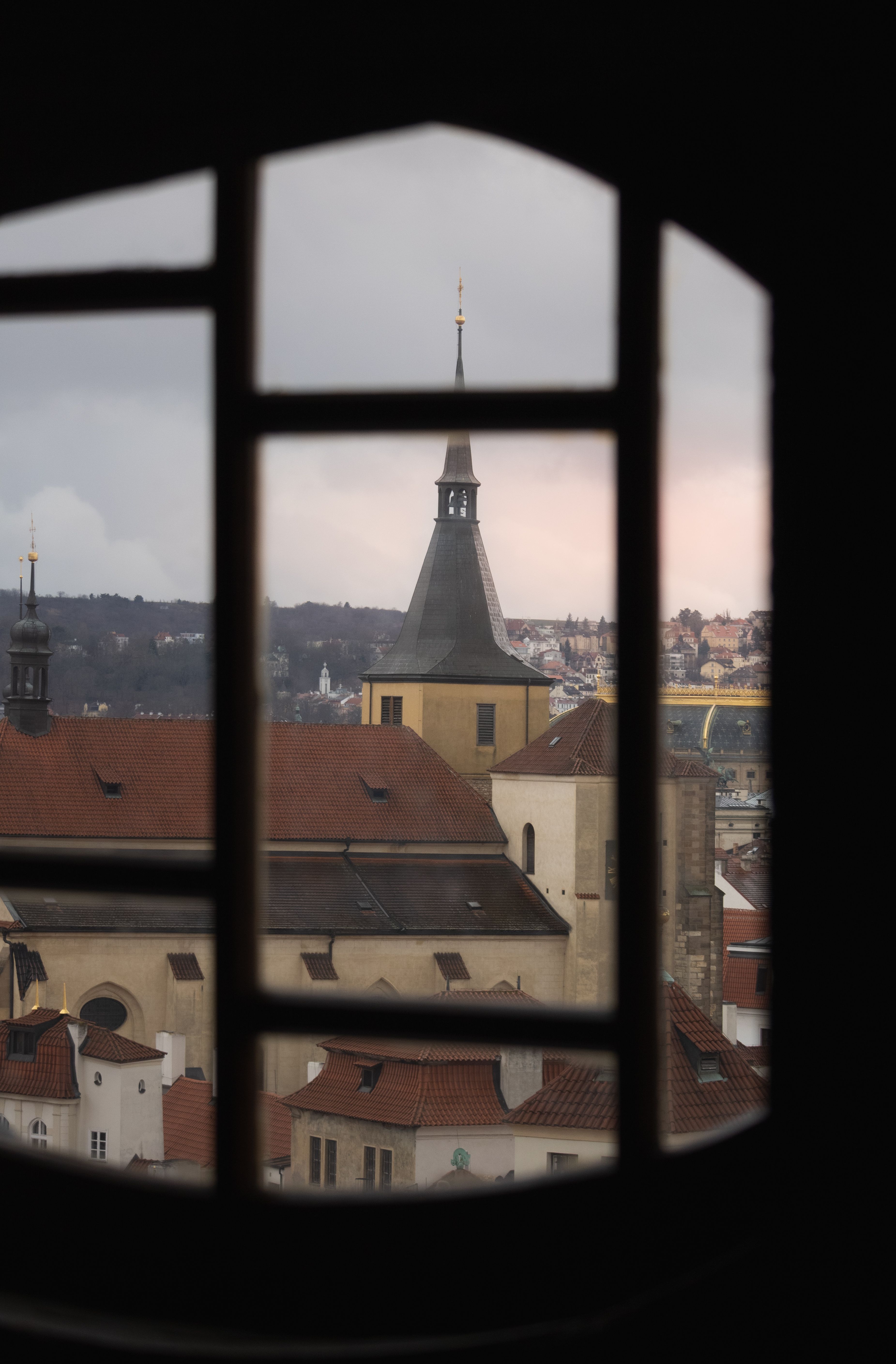 Prague castle through a window · Free Stock Photo