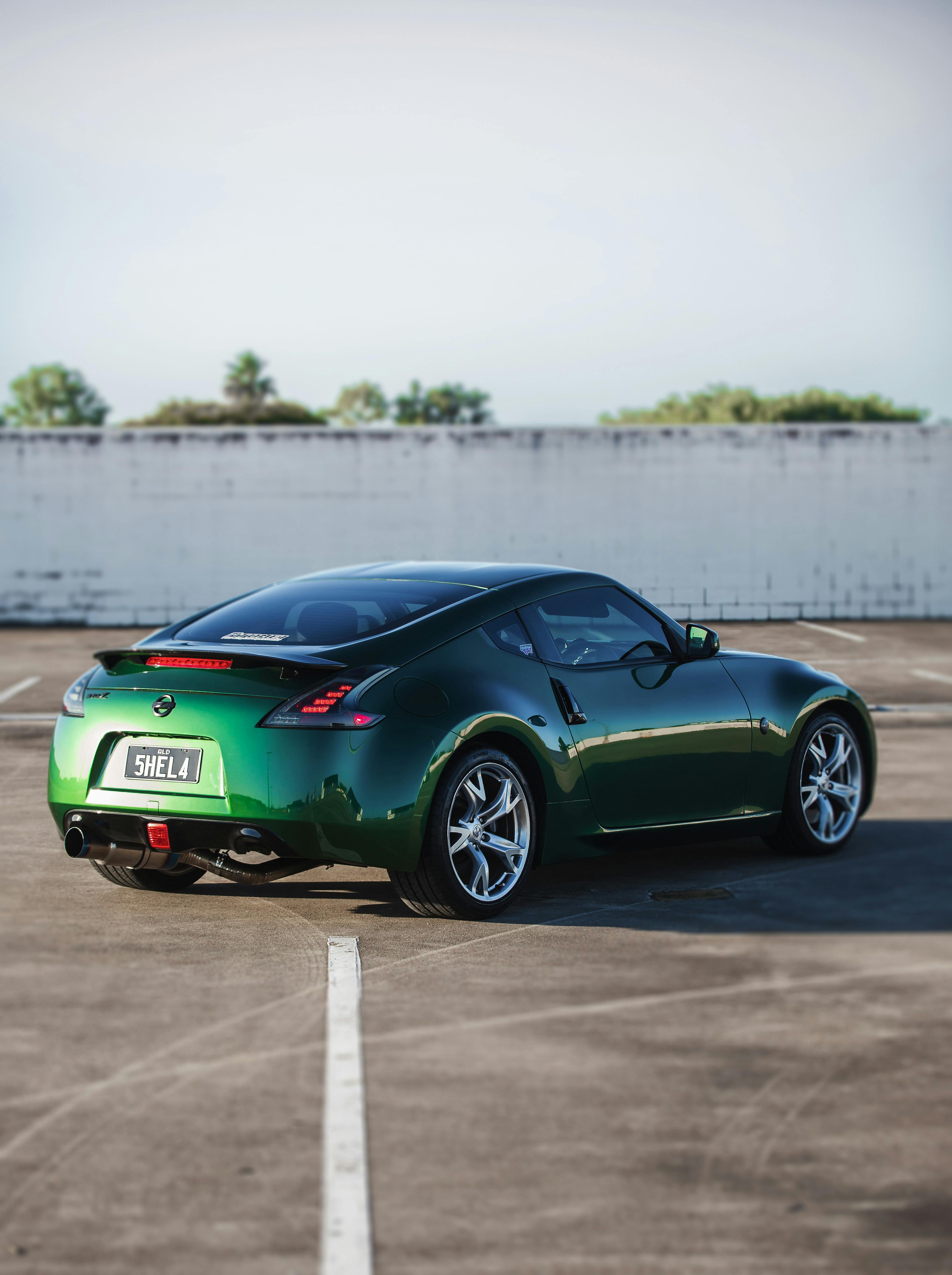 View of a Green Nissan 370Z on a Parking Lot · Free Stock Photo