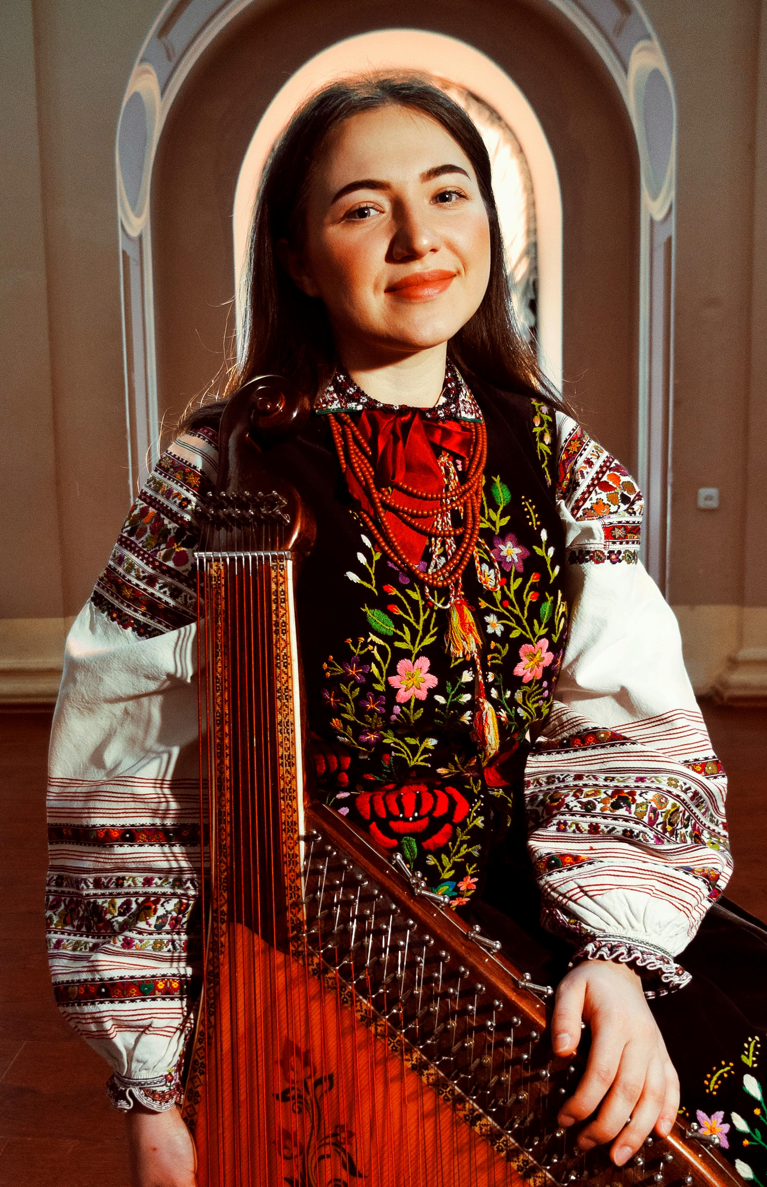 Woman in Folklore Clothes with Traditional Instrument · Free Stock Photo