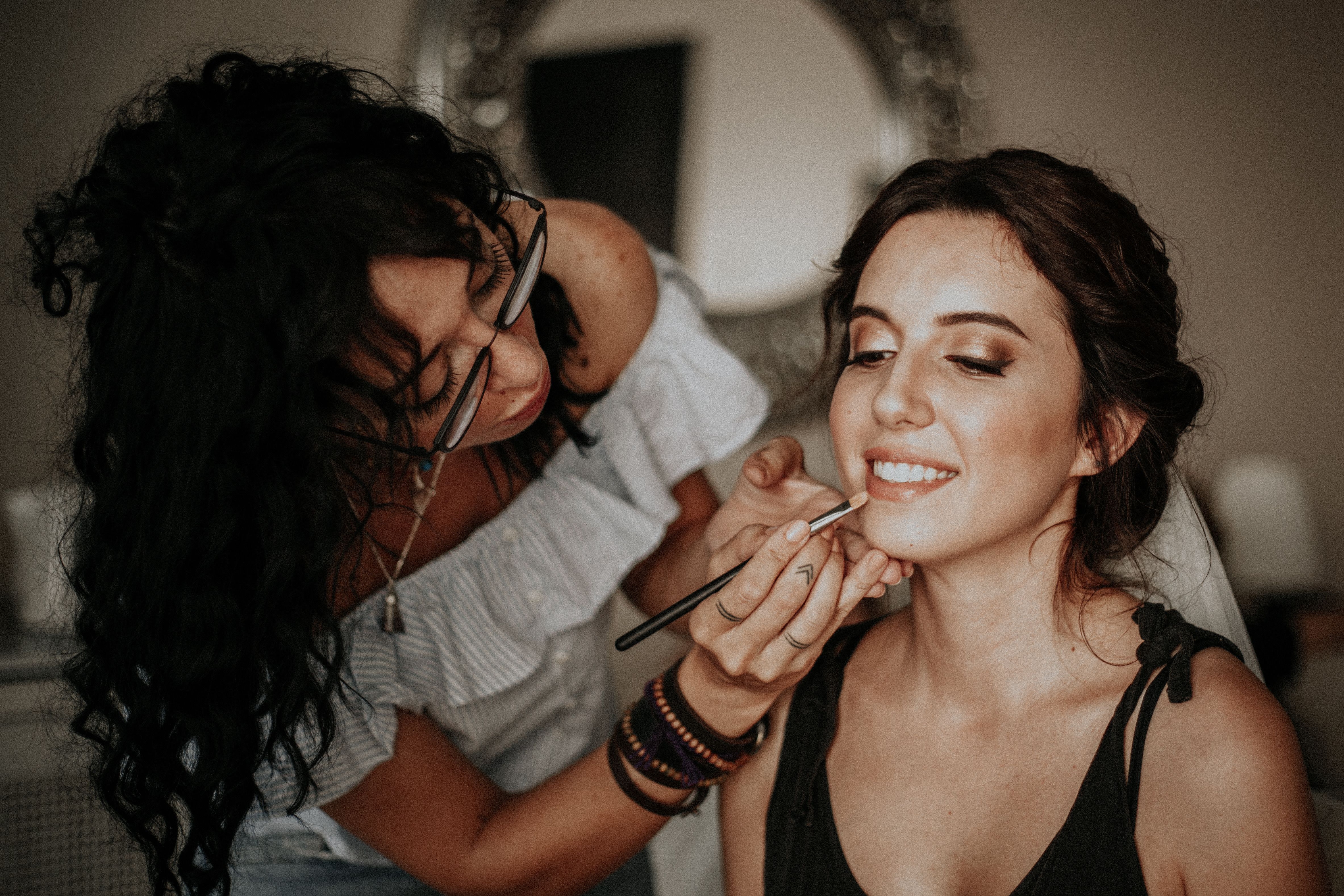 Beautician Putting Make Up on a Customer Face · Free Stock Photo