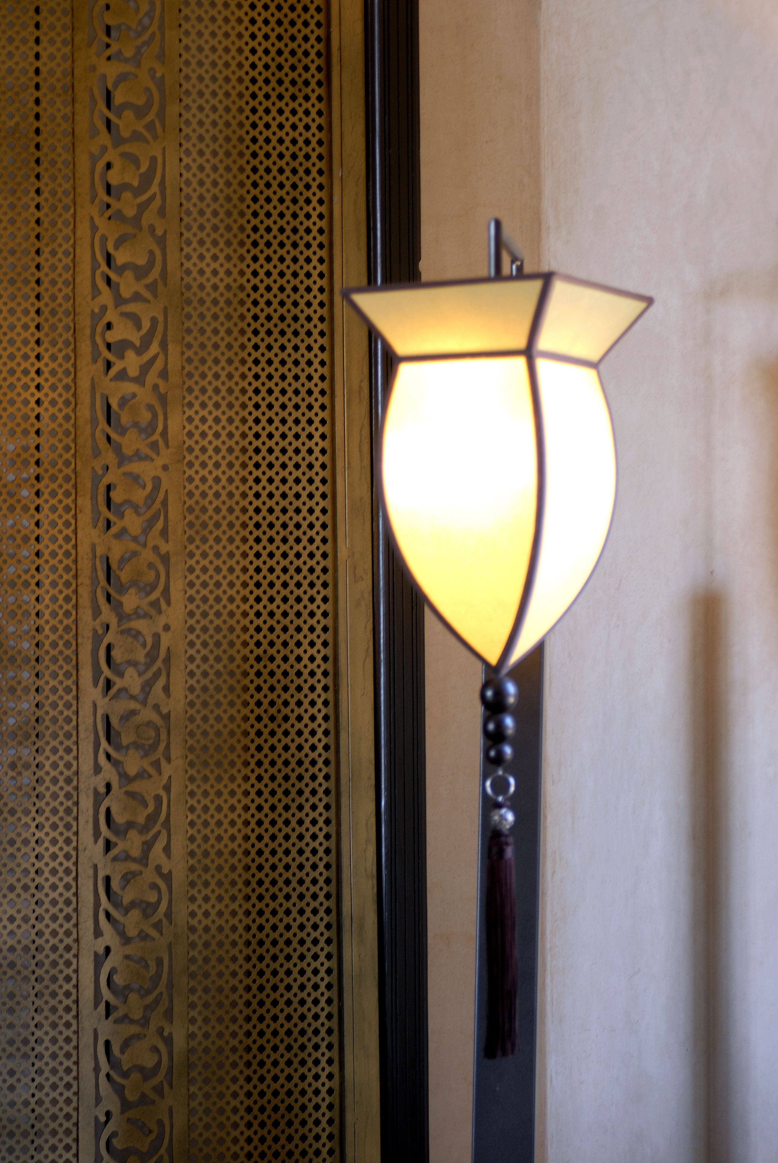 Close-Up Shot of a Lamp Hanging on a Wall · Free Stock Photo