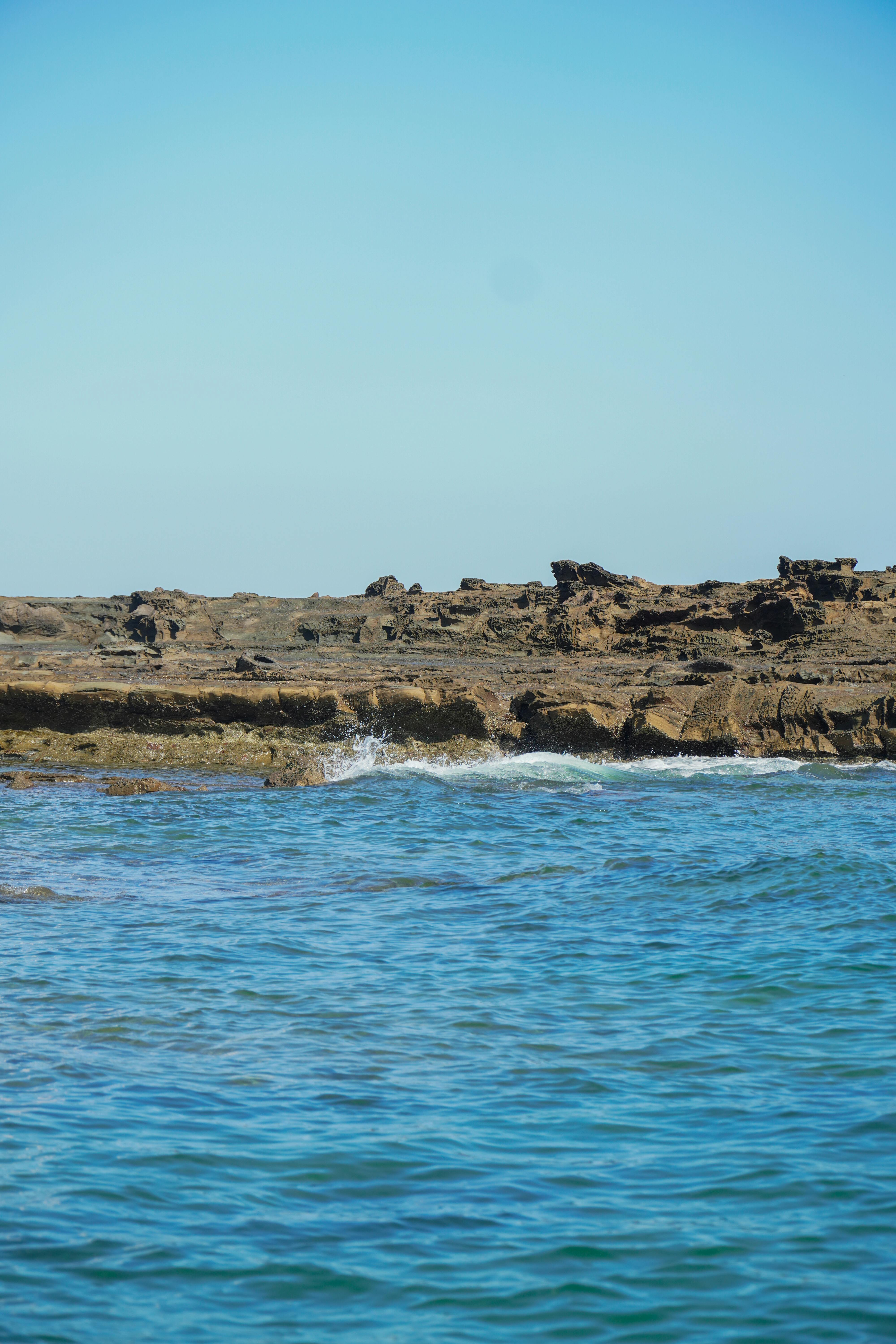 Water Splashing on Rocks on Seashore · Free Stock Photo