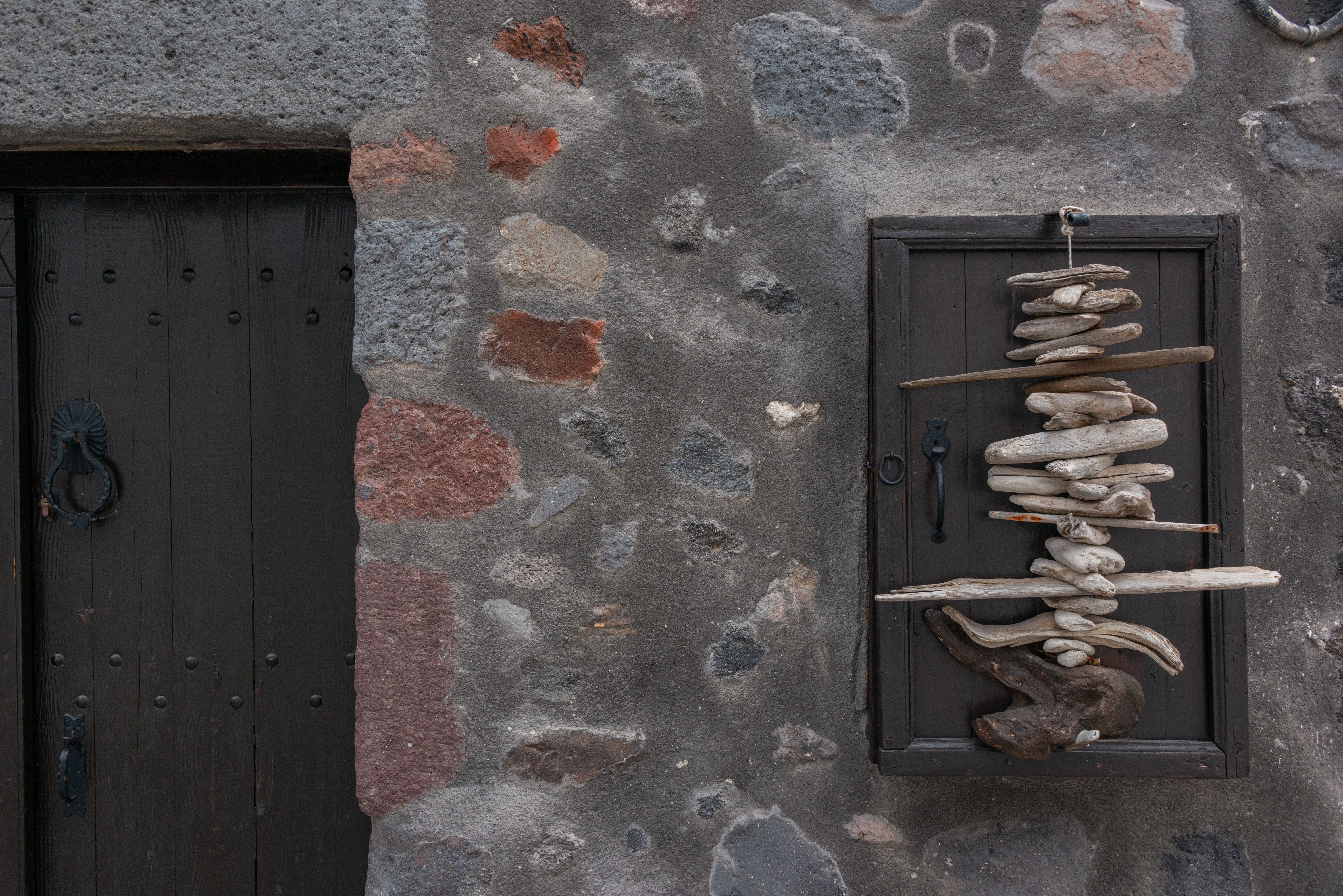 Pile of Wooden Sticks Hanging in Window · Free Stock Photo