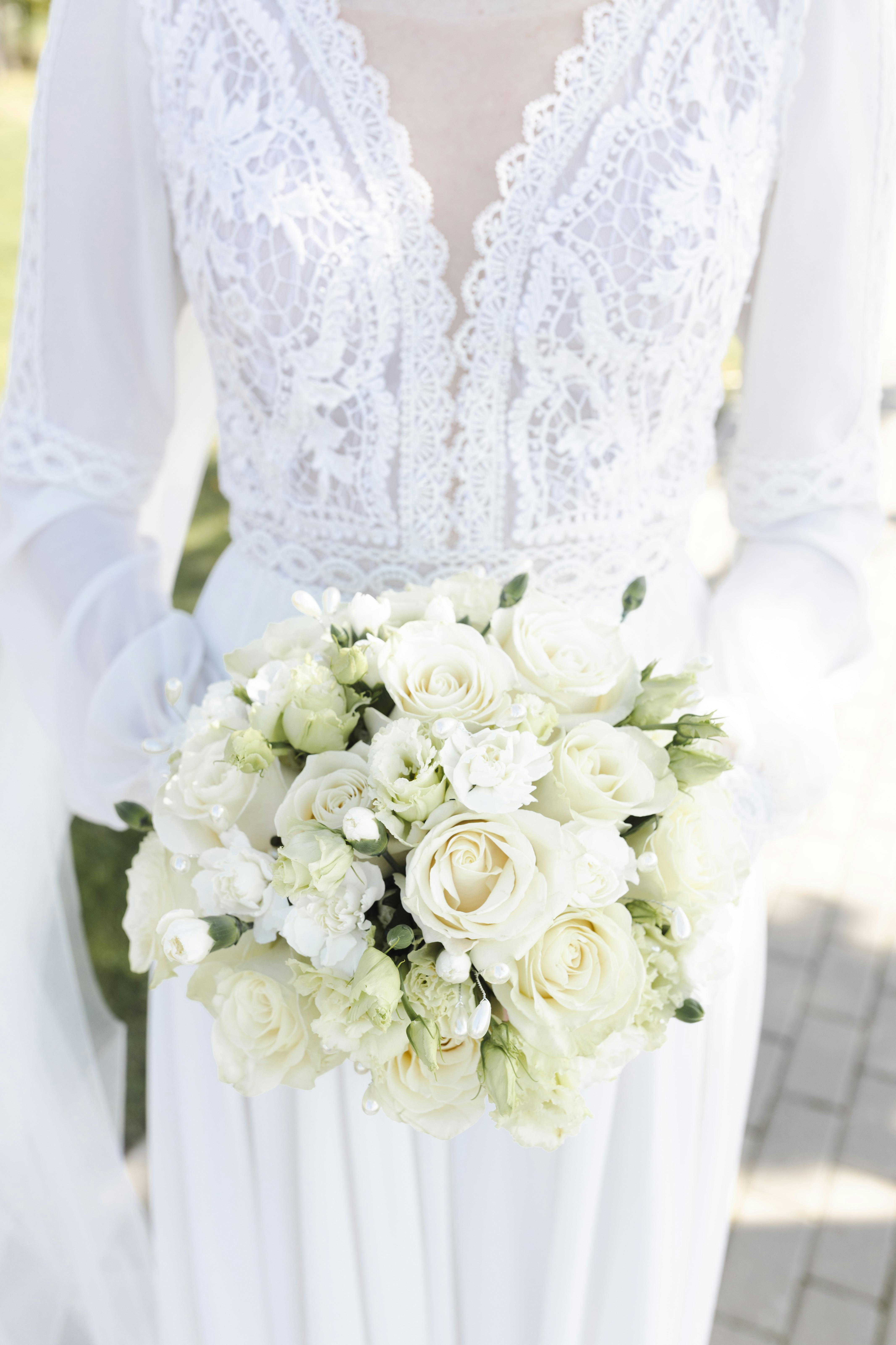 Bride Holding Bridal Bouquet · Free Stock Photo