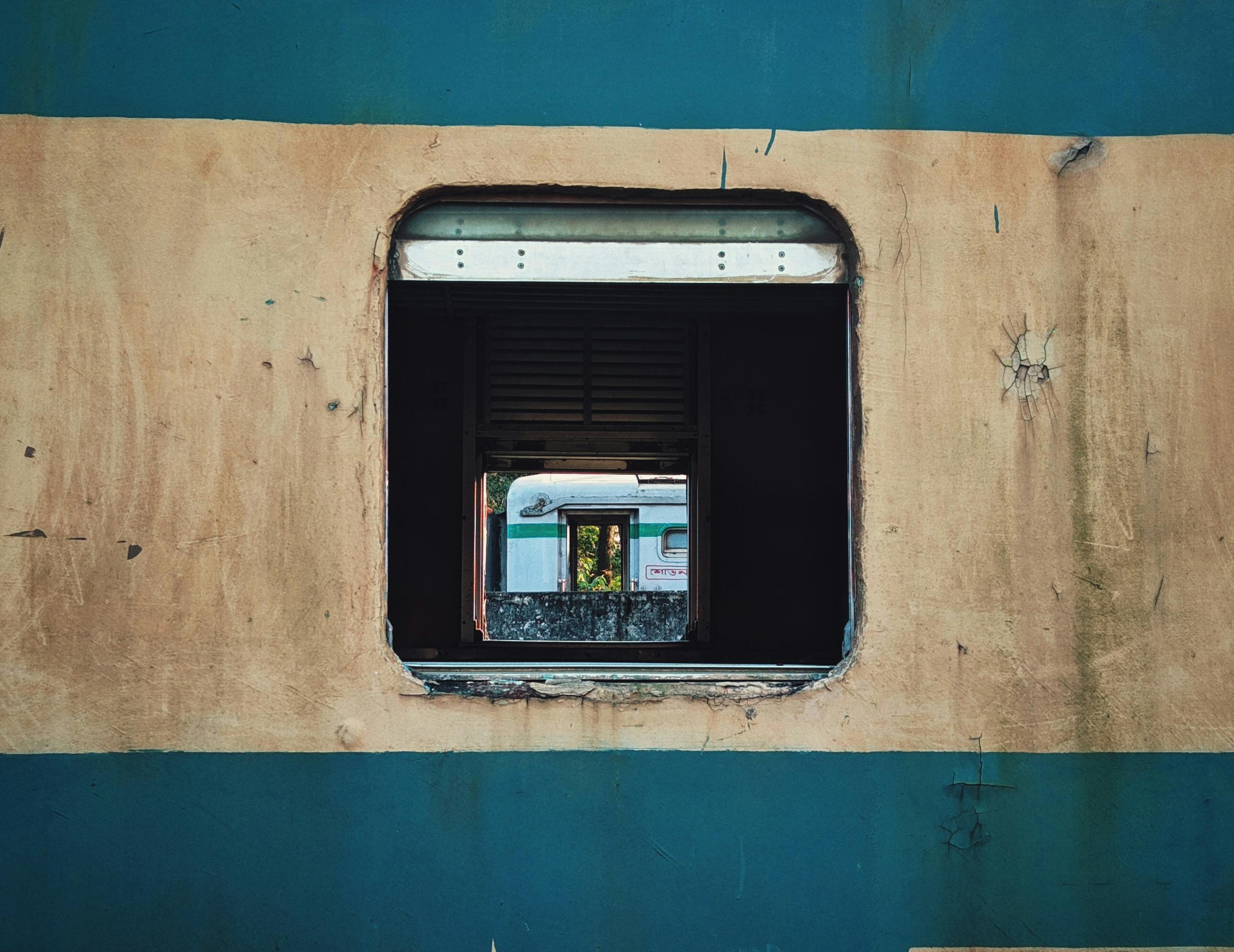 Destroyed Window of Carriage Train · Free Stock Photo