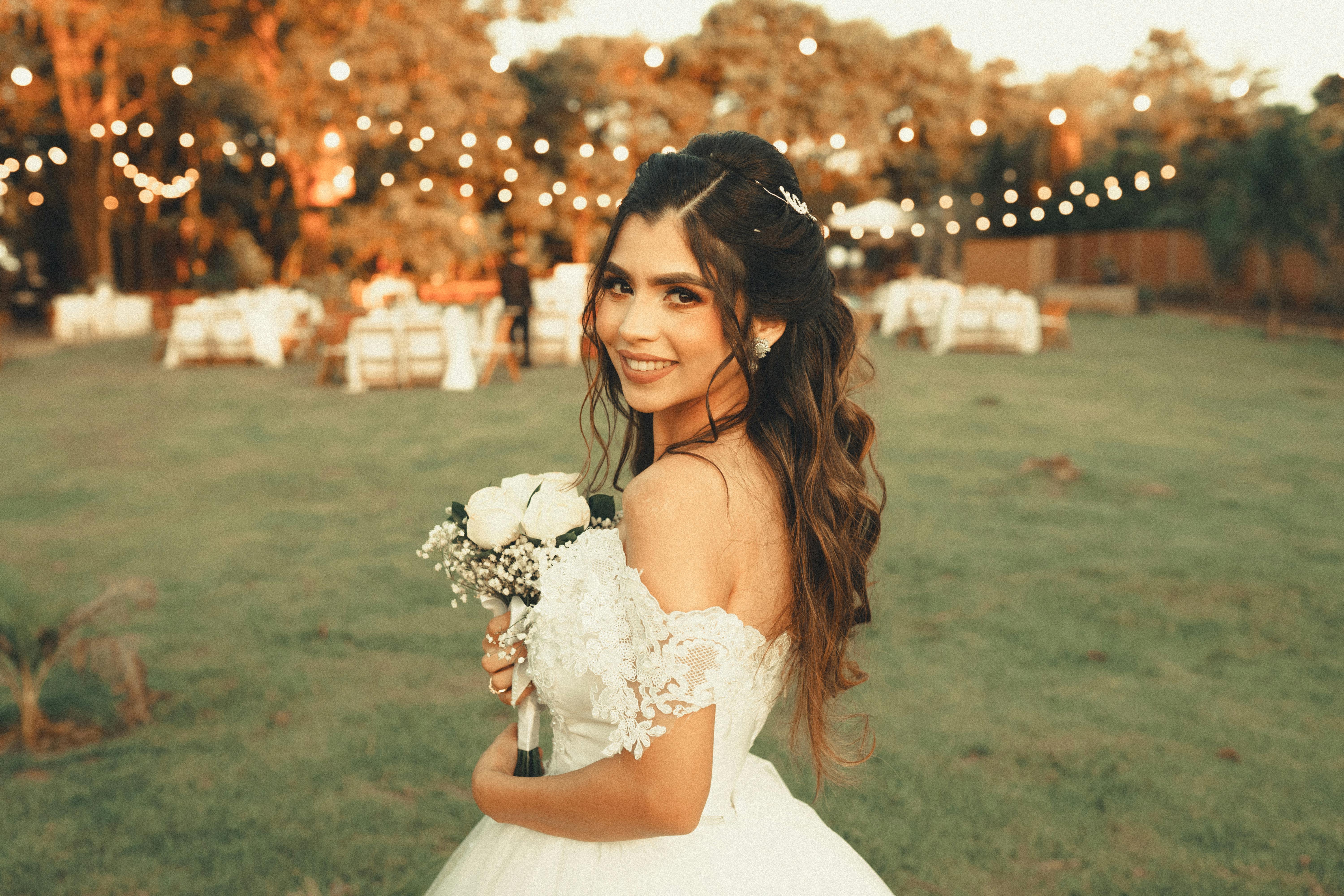 A Smiling Bride with a Sunflower · Free Stock Photo
