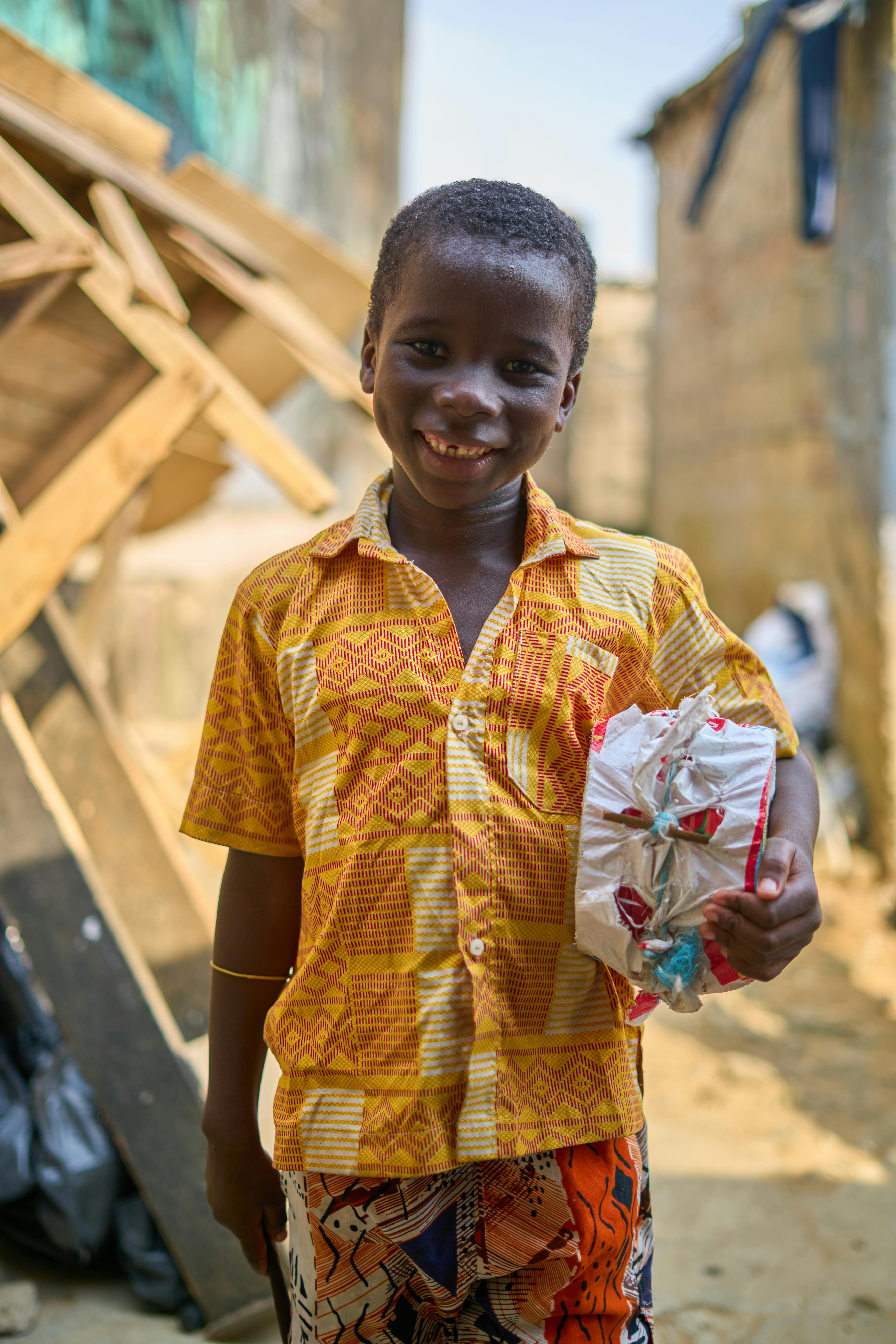 Smiling Child with Present · Free Stock Photo