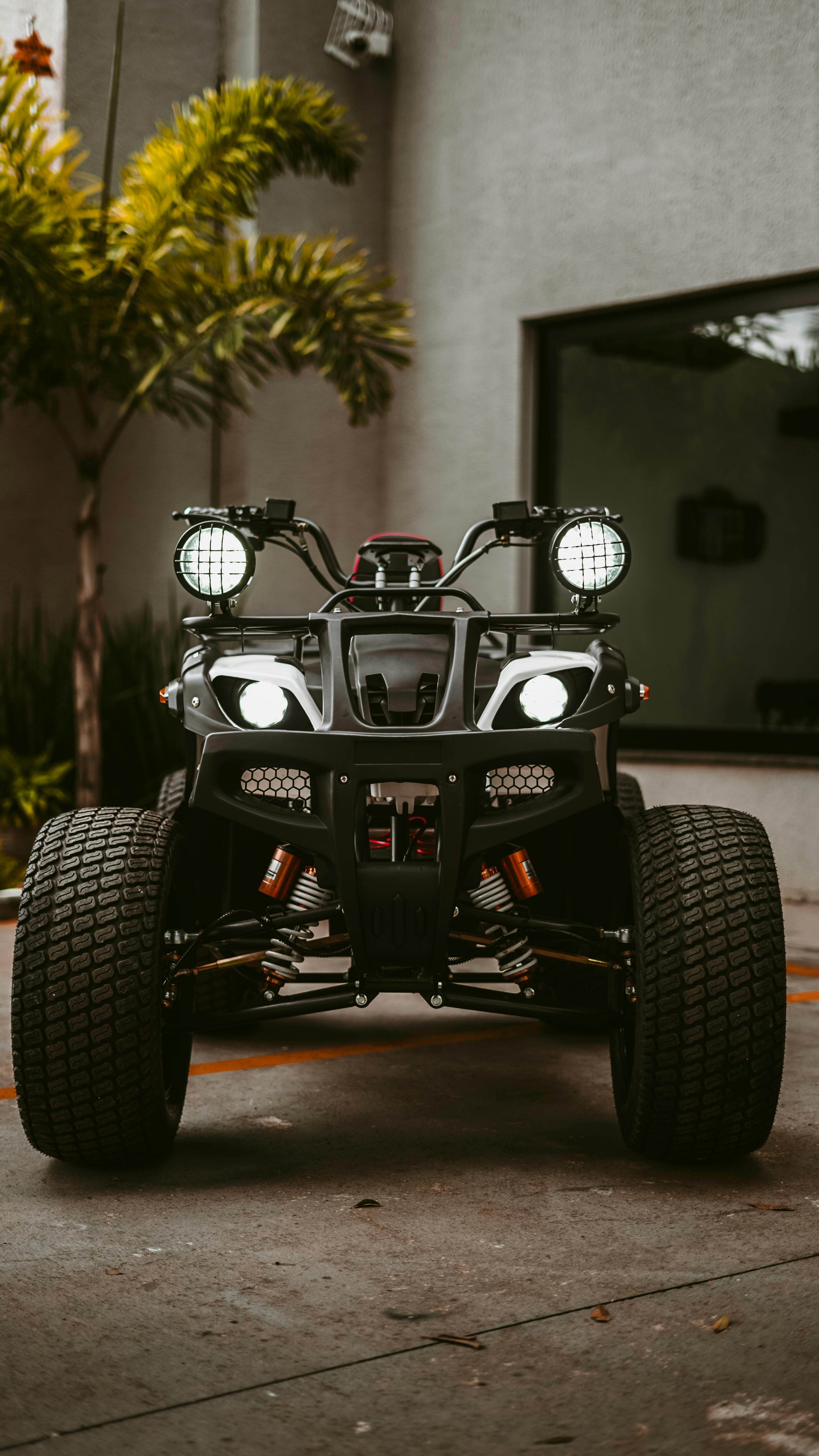 Quad near Building Wall and Window · Free Stock Photo