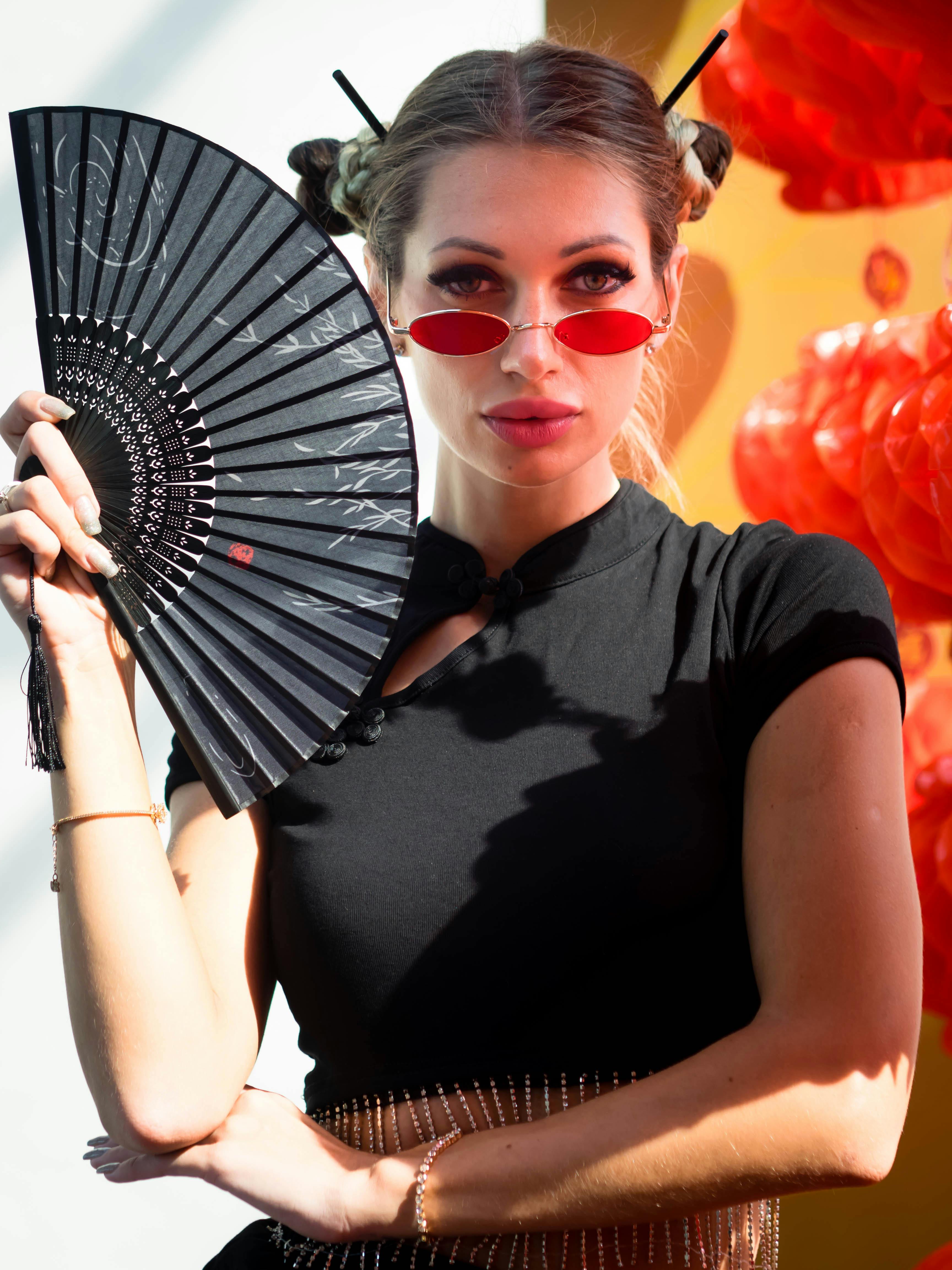 Woman Posing with Fan · Free Stock Photo