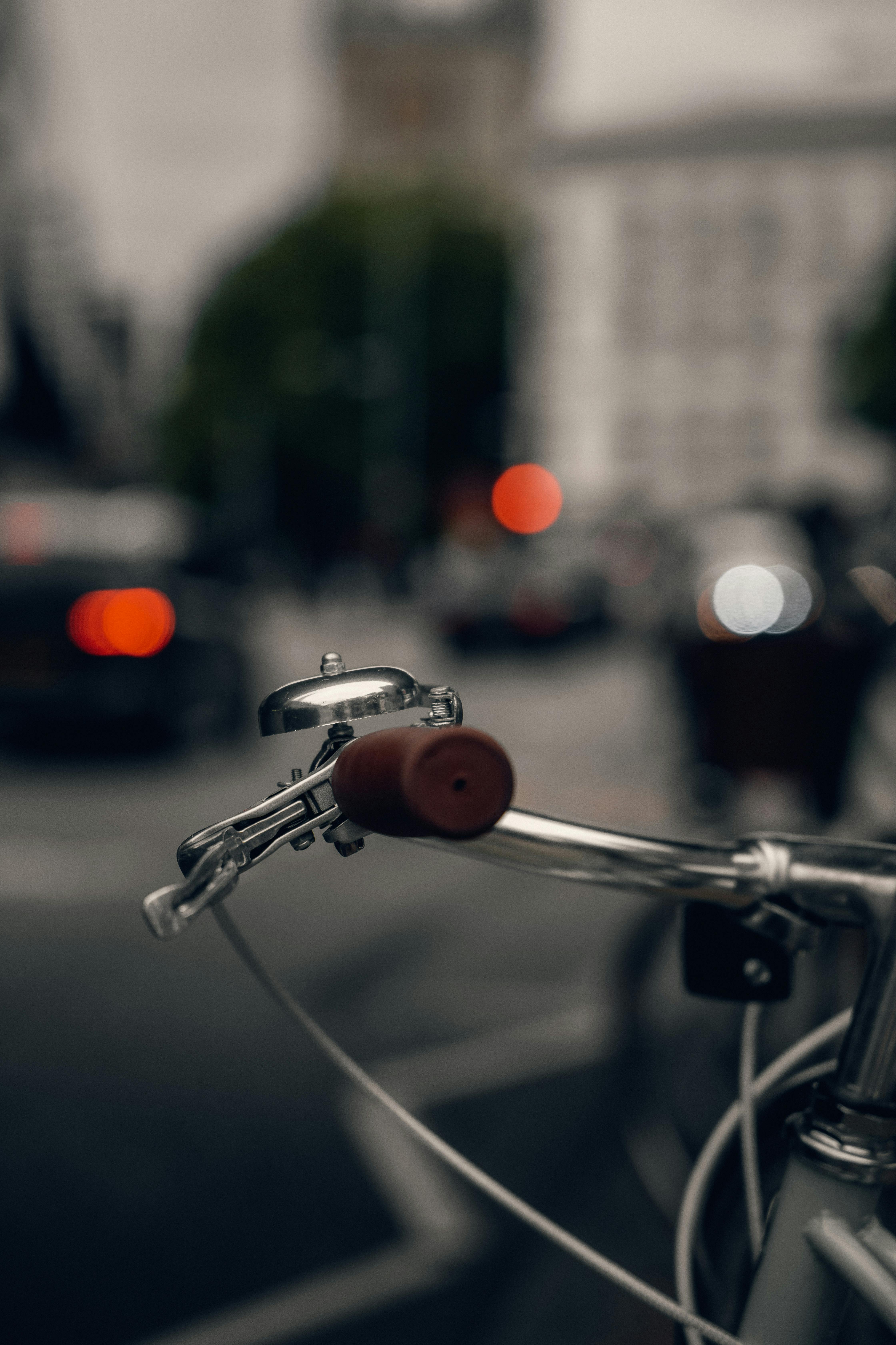 A close up of a bike handlebar with a red light · Free Stock Photo