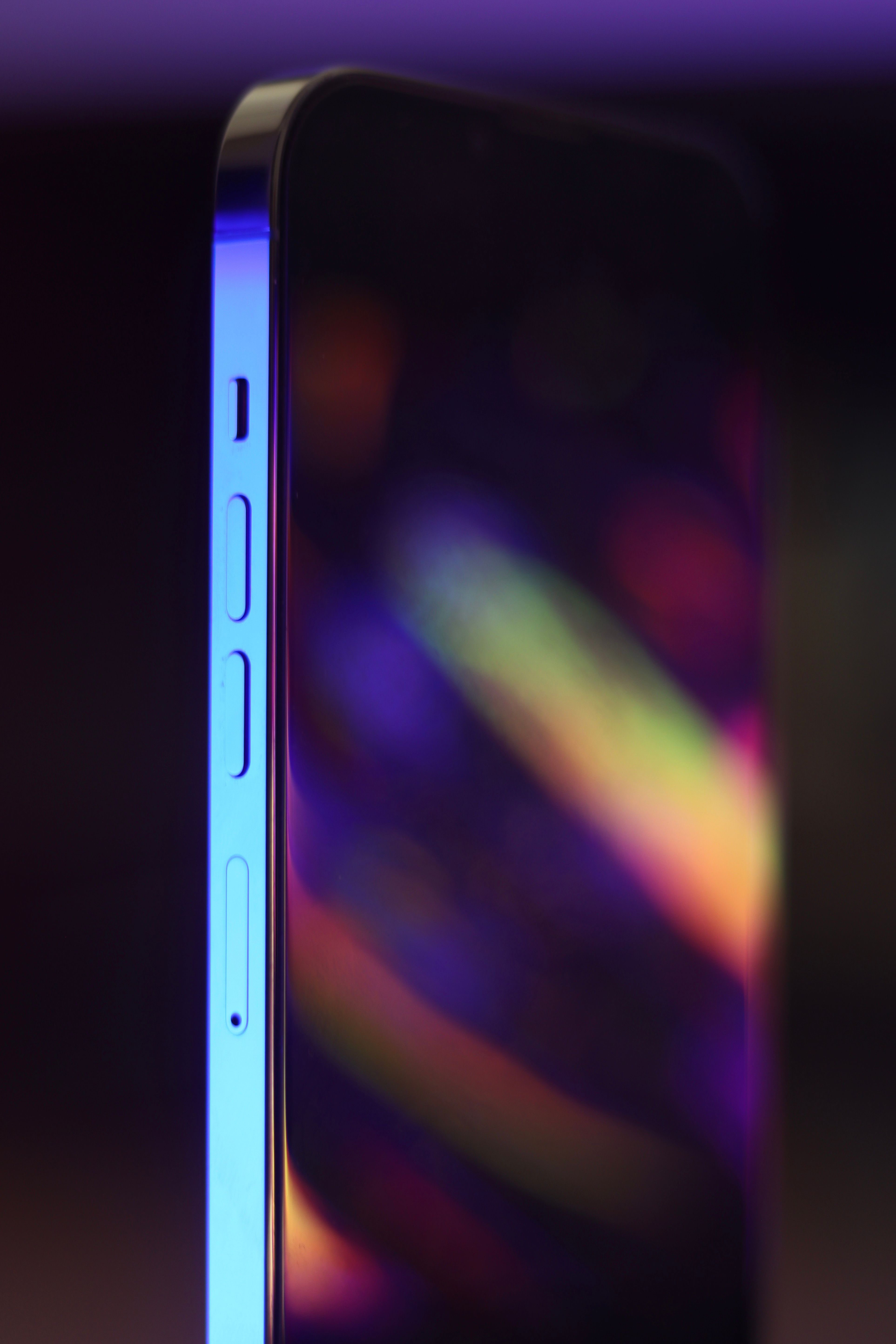 The back of a smartphone with a colorful light · Free Stock Photo
