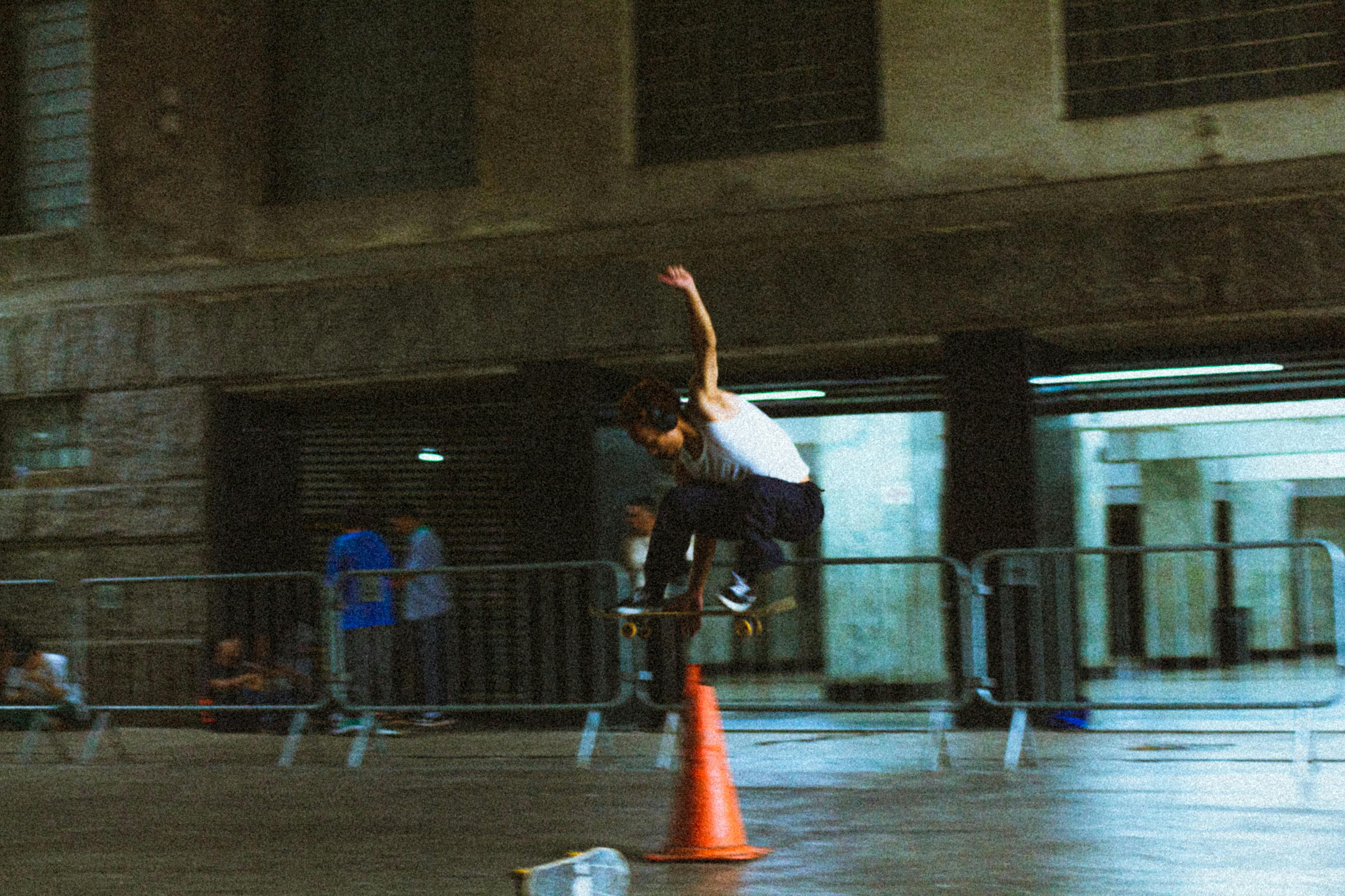 Man Jumping over Cone on Skateboard · Free Stock Photo