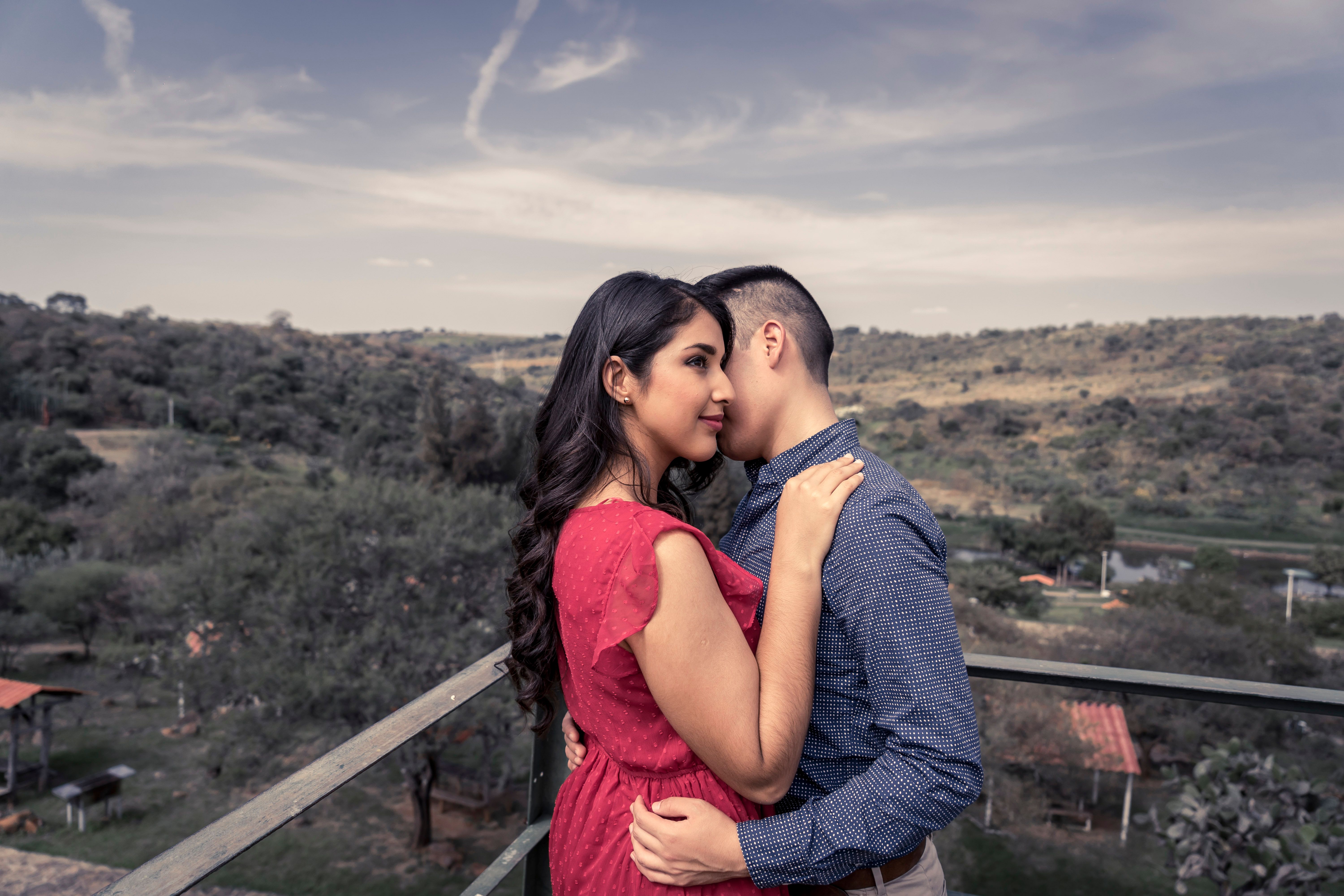 Embracing Couple on Terrace · Free Stock Photo