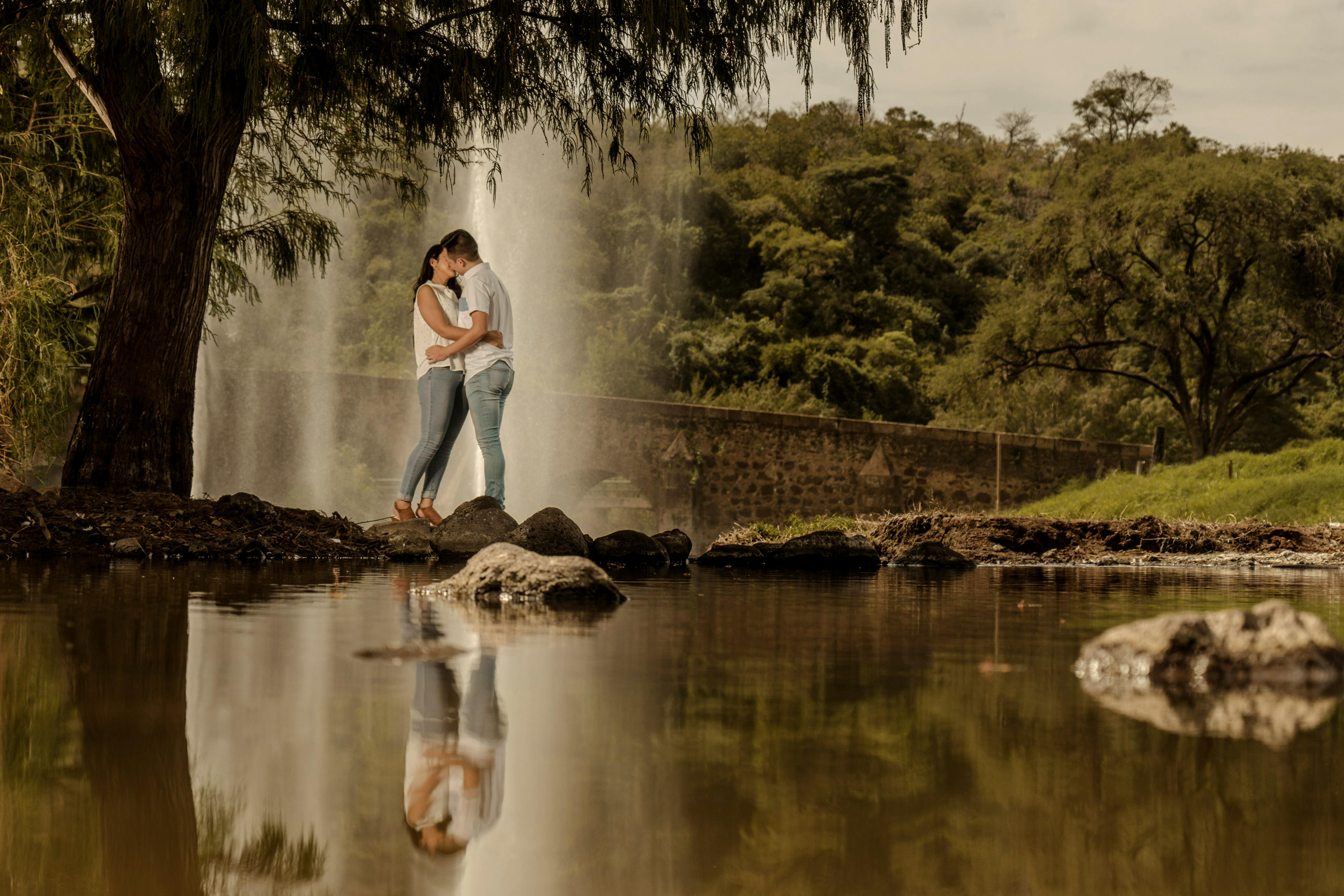 Couple Kissing at the River · Free Stock Photo