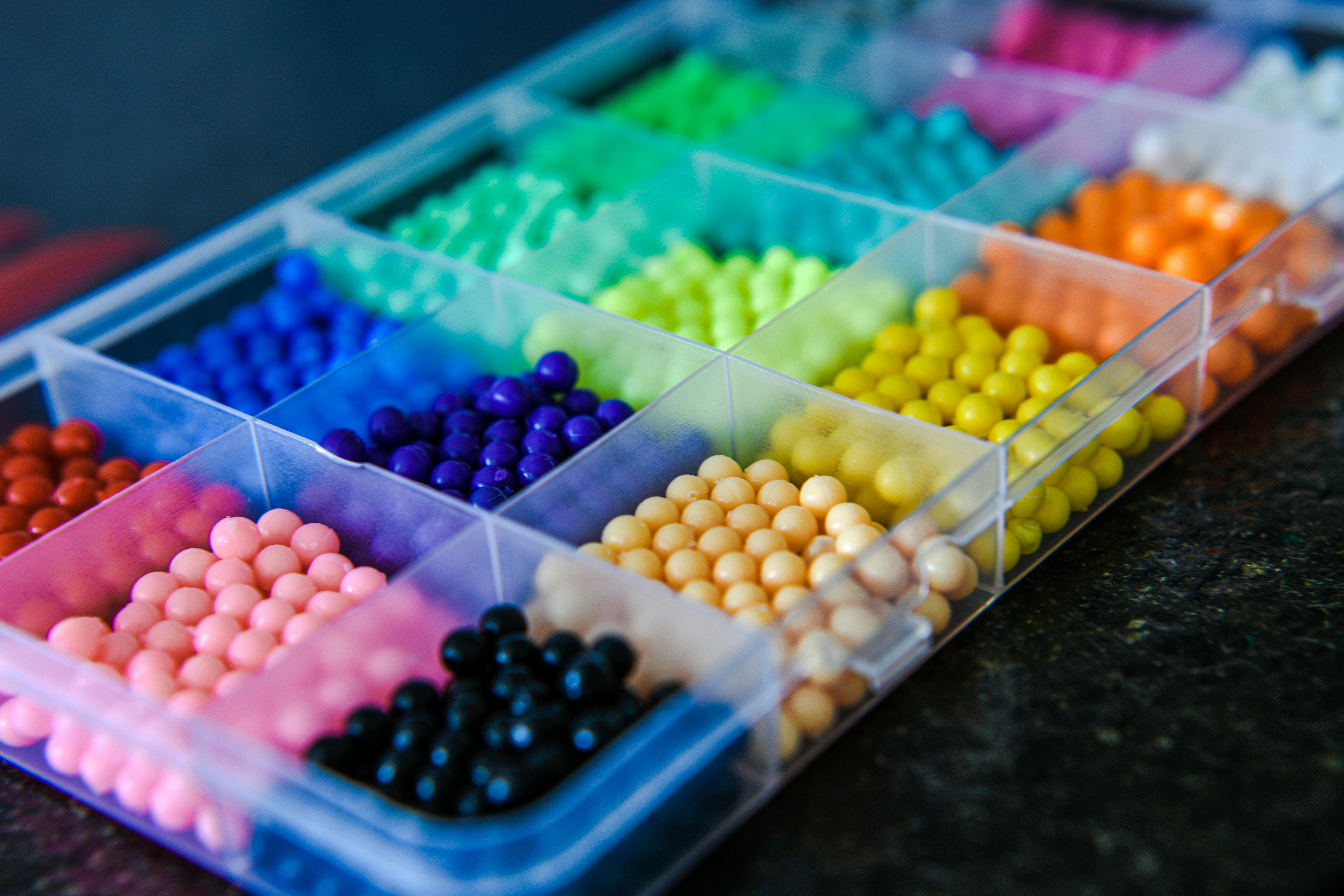 Sorted Colorful Balls in Plastic Box · Free Stock Photo