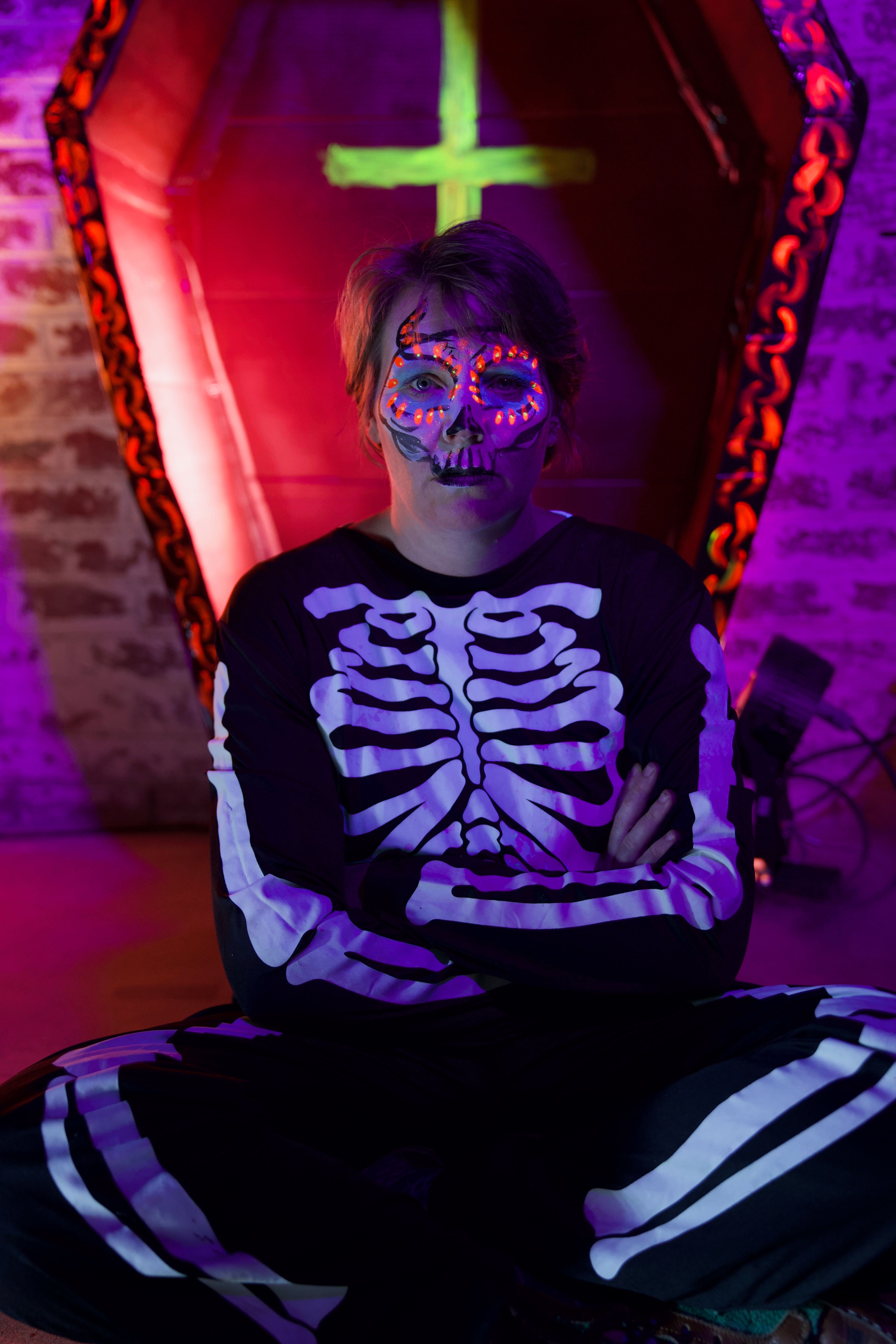 Person in Skeleton Costume Sitting on Floor · Free Stock Photo