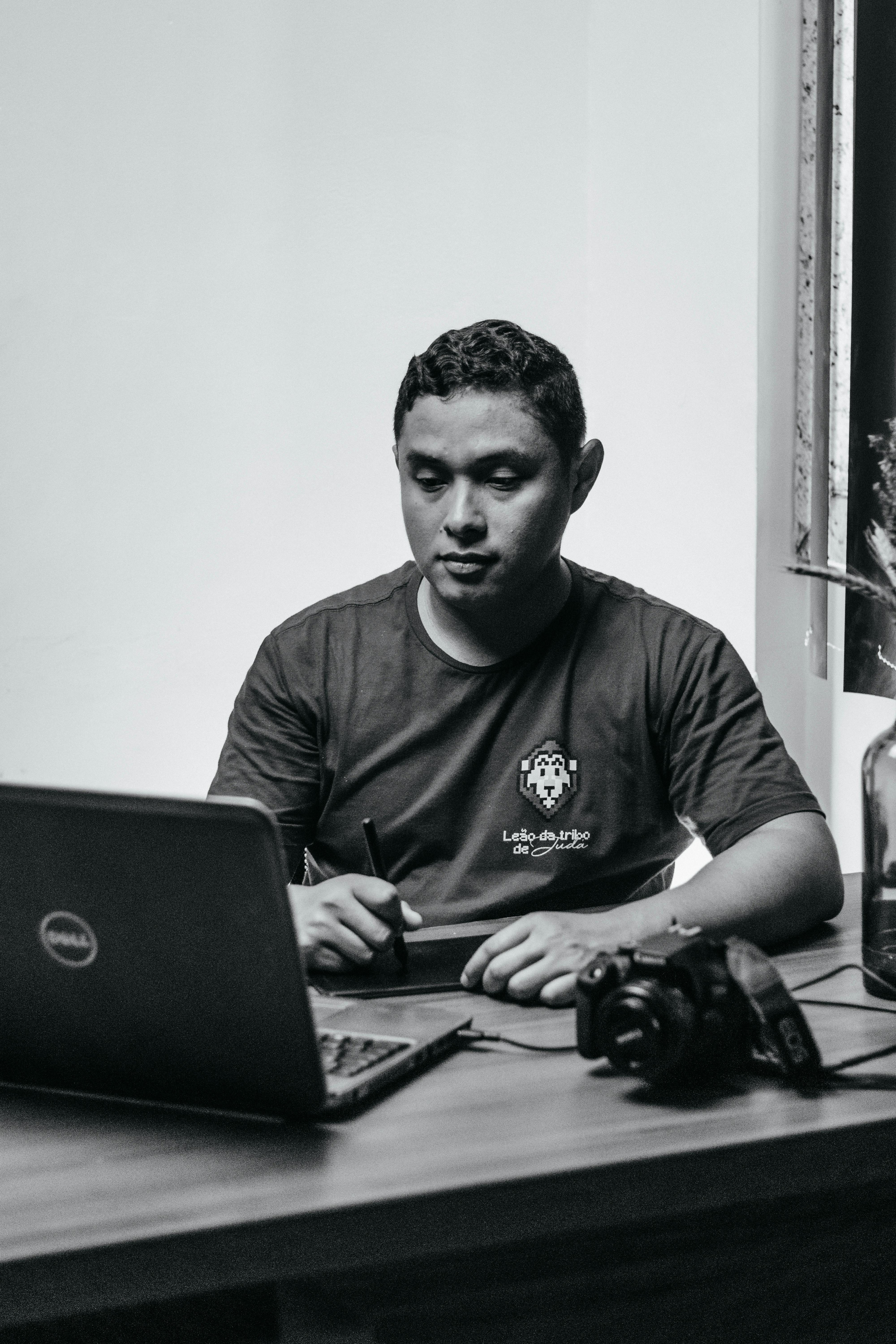 Man Editing Photos with Use of Laptop and Tablet · Free Stock Photo