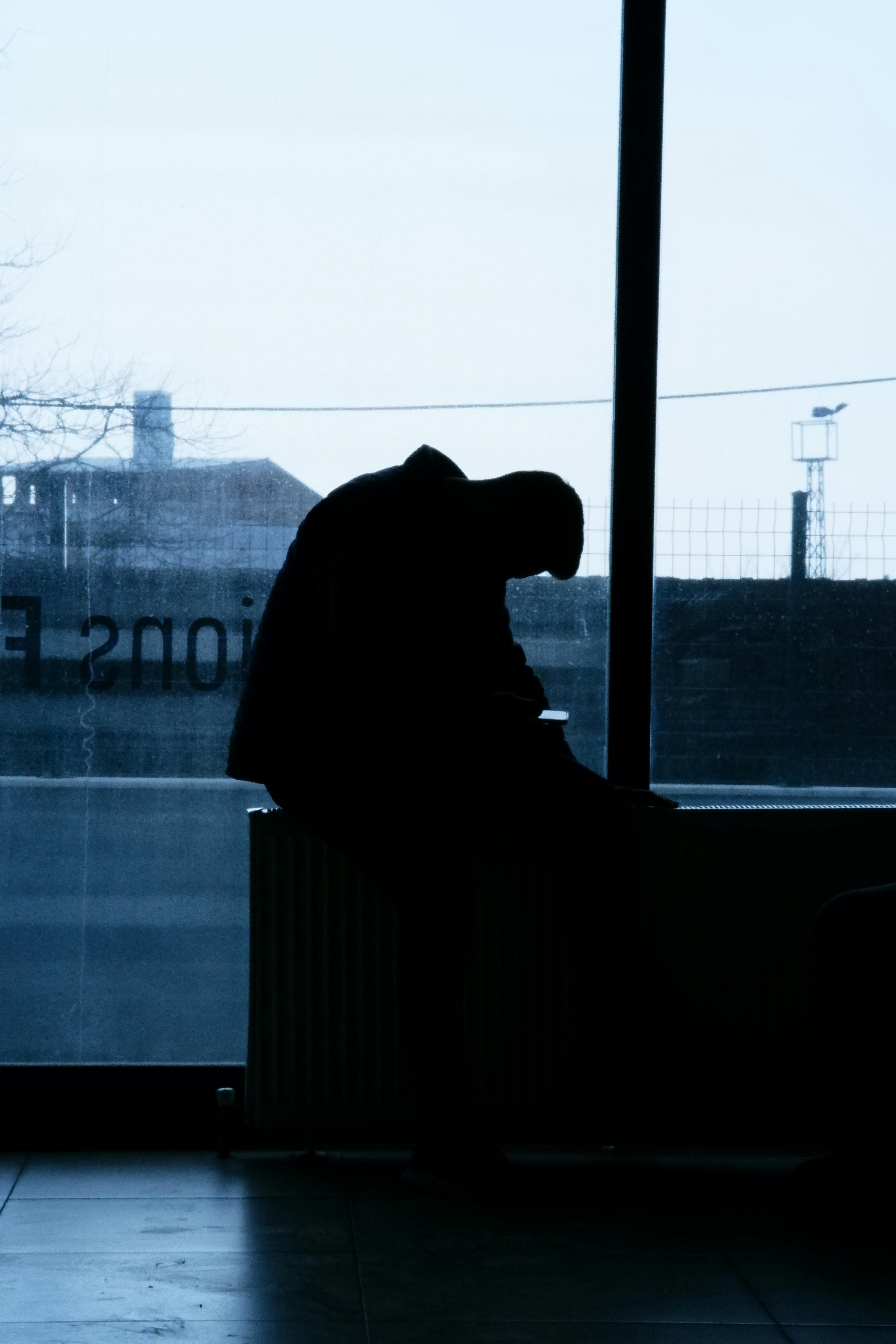 Man Standing near Window · Free Stock Photo