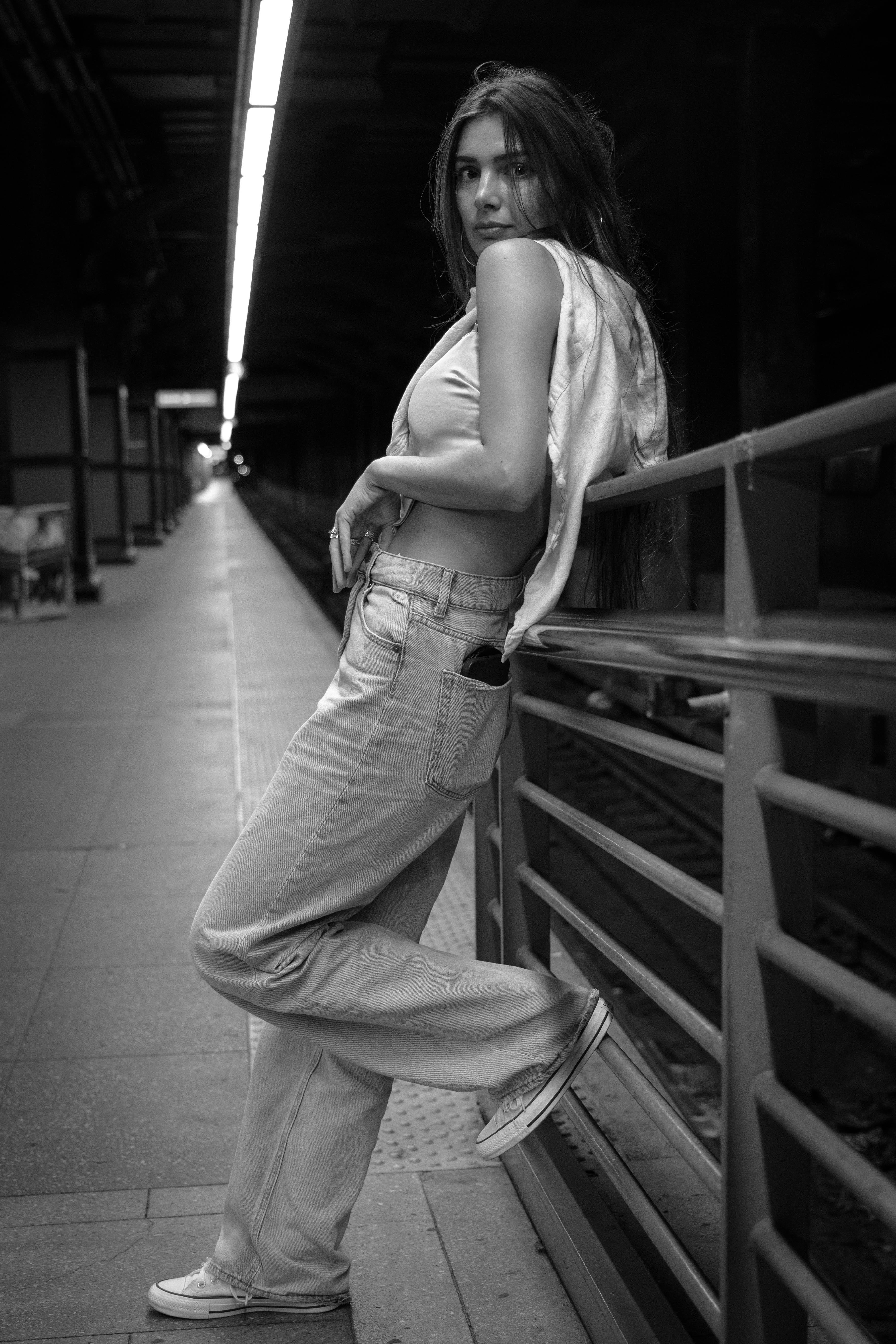Woman in Black Leaning against Railing · Free Stock Photo
