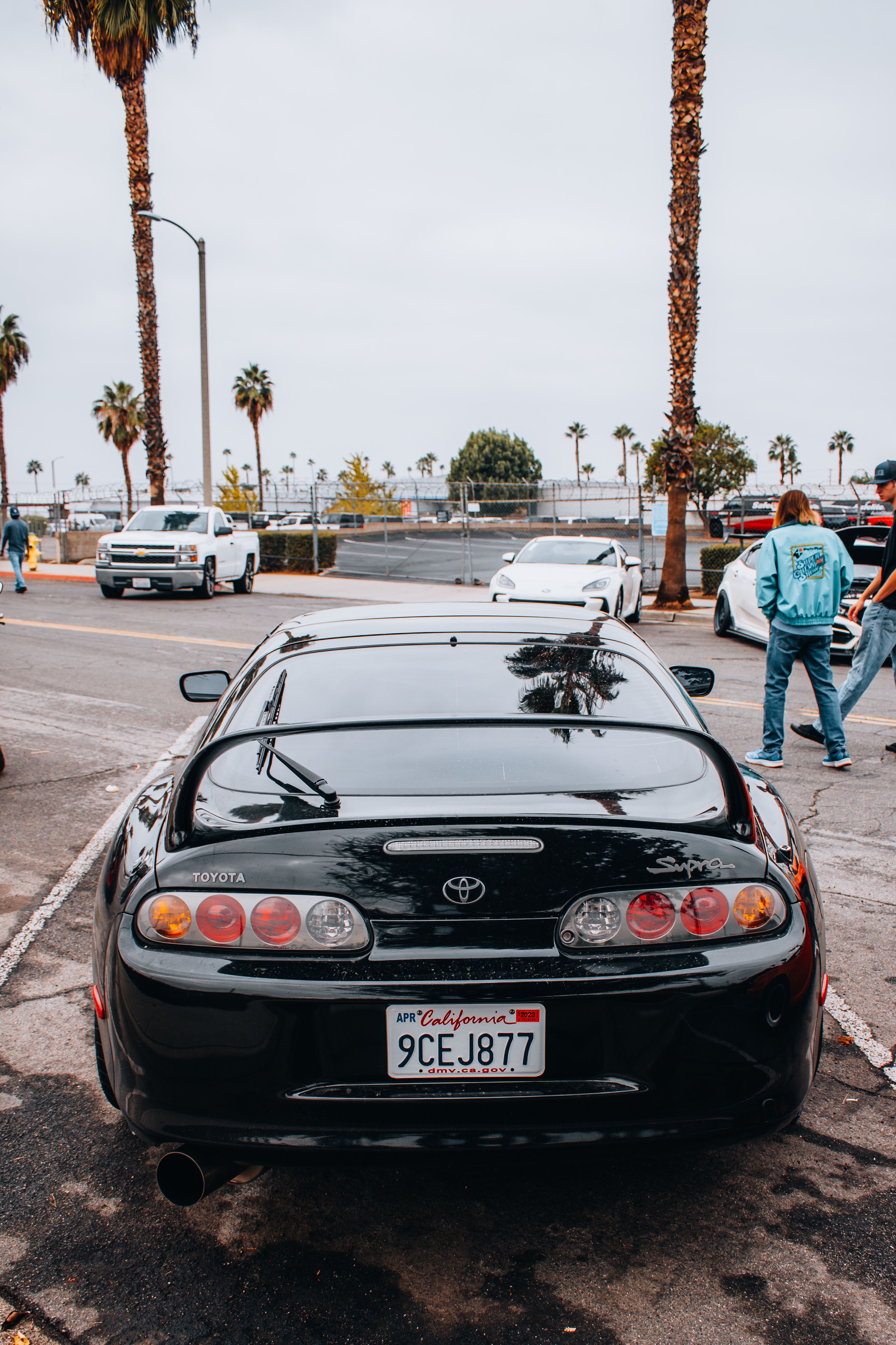 Black Toyota Supra Parked on Street next to Palm Trees · Free Stock Photo