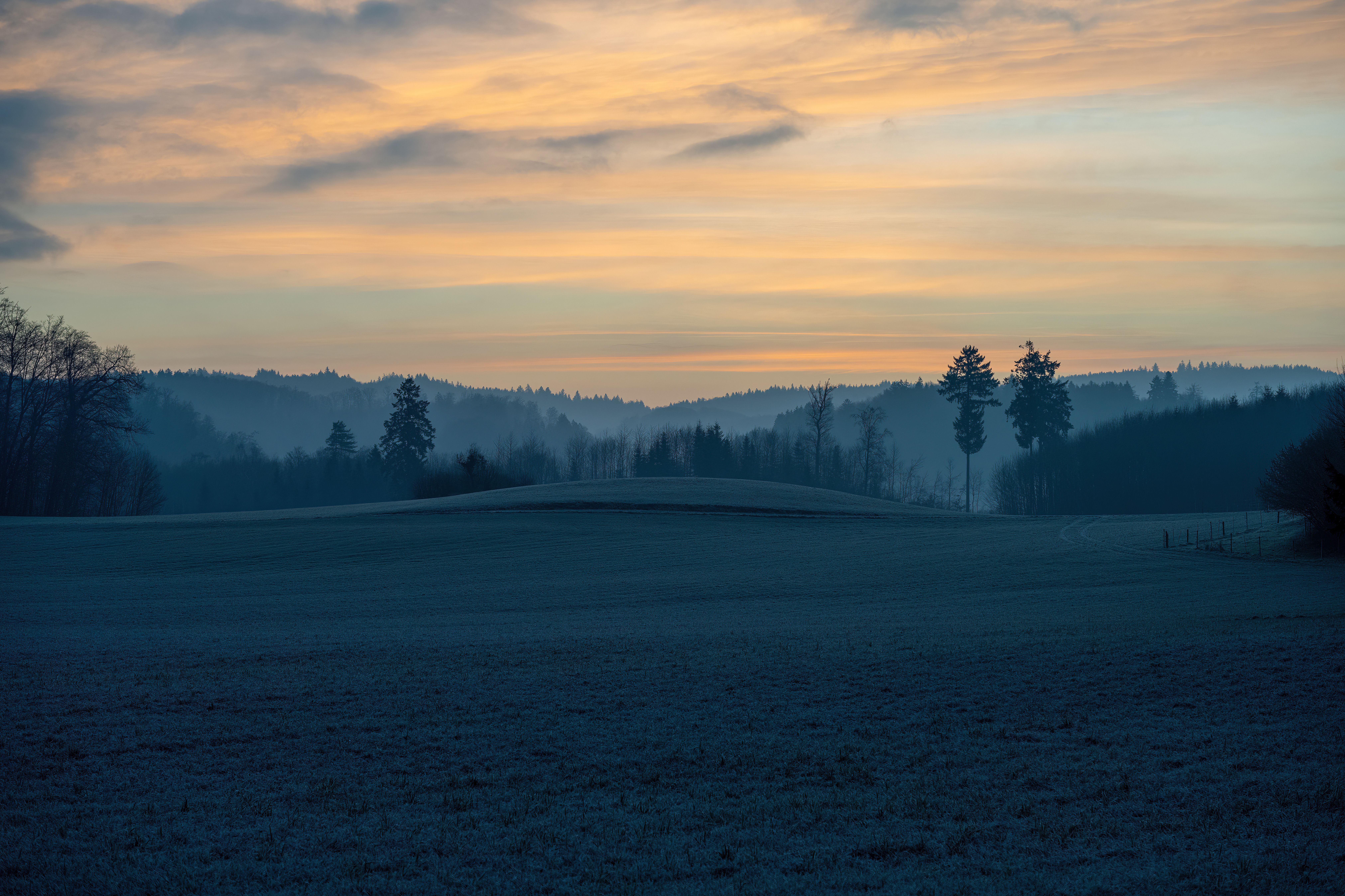 Countryside under a Dramatic Sky at Dusk · Free Stock Photo