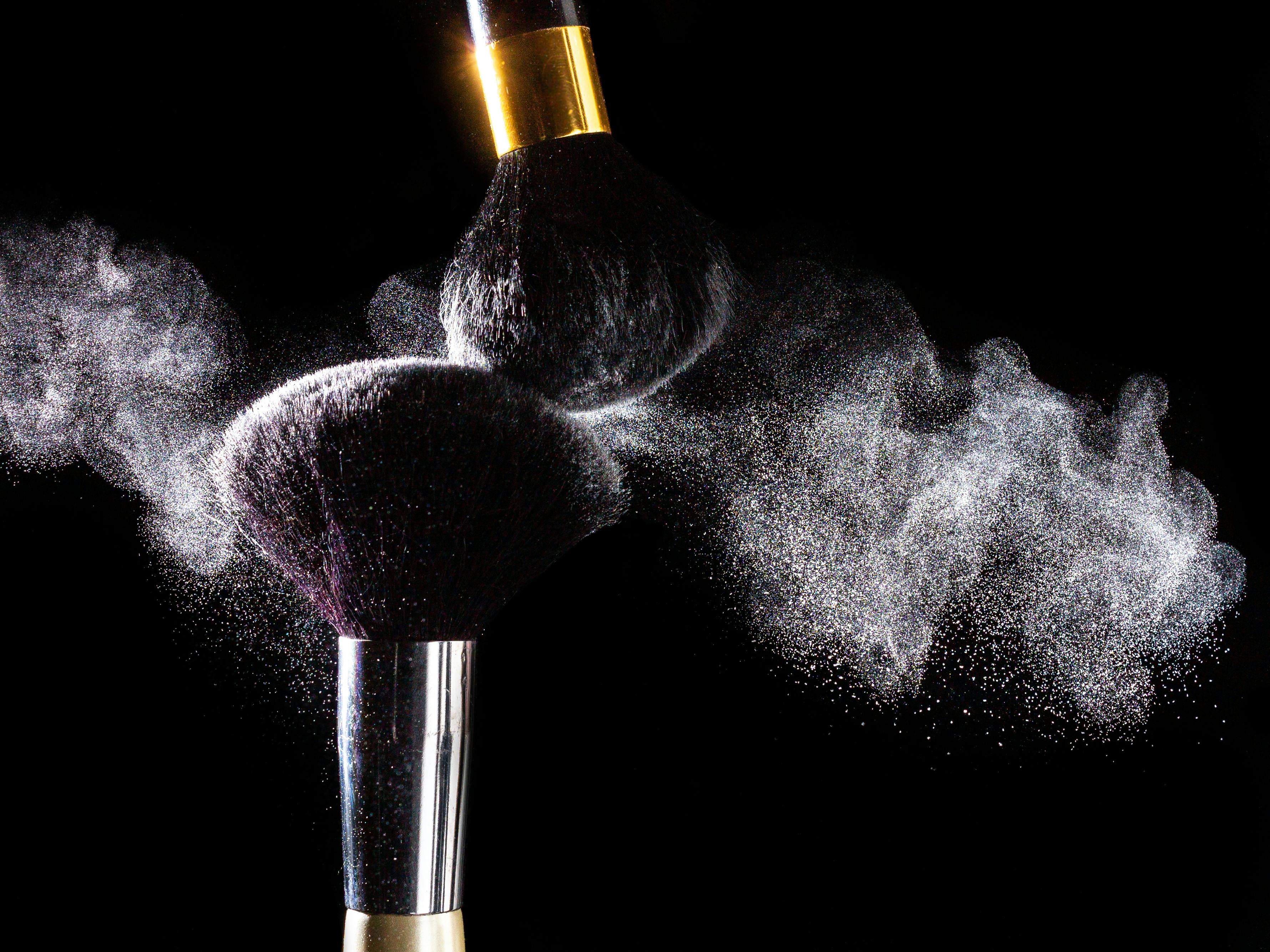 Cosmetics Makeup Brushes and Powder Dust Explosion · Free Stock Photo