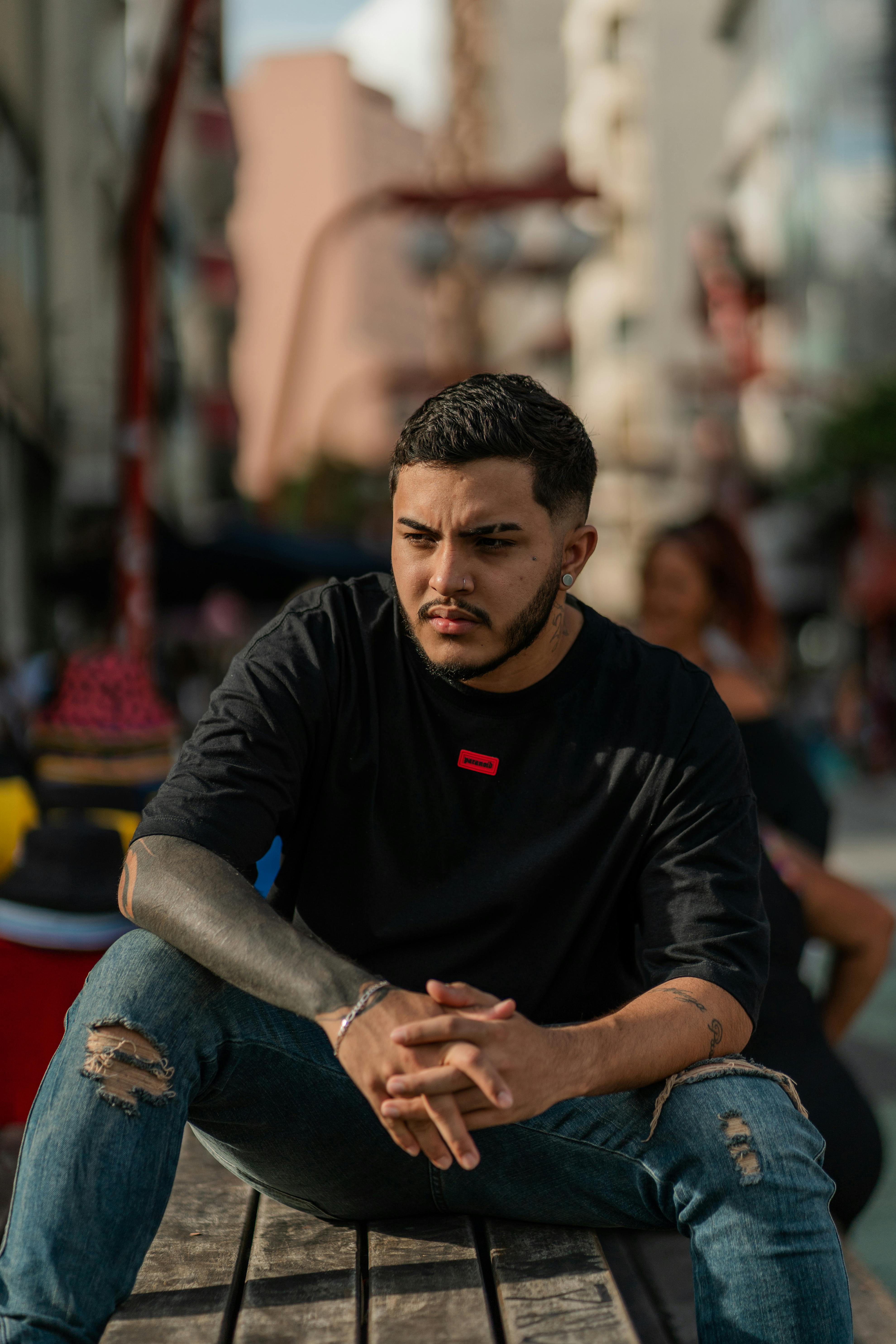 Man Sitting and Posing · Free Stock Photo