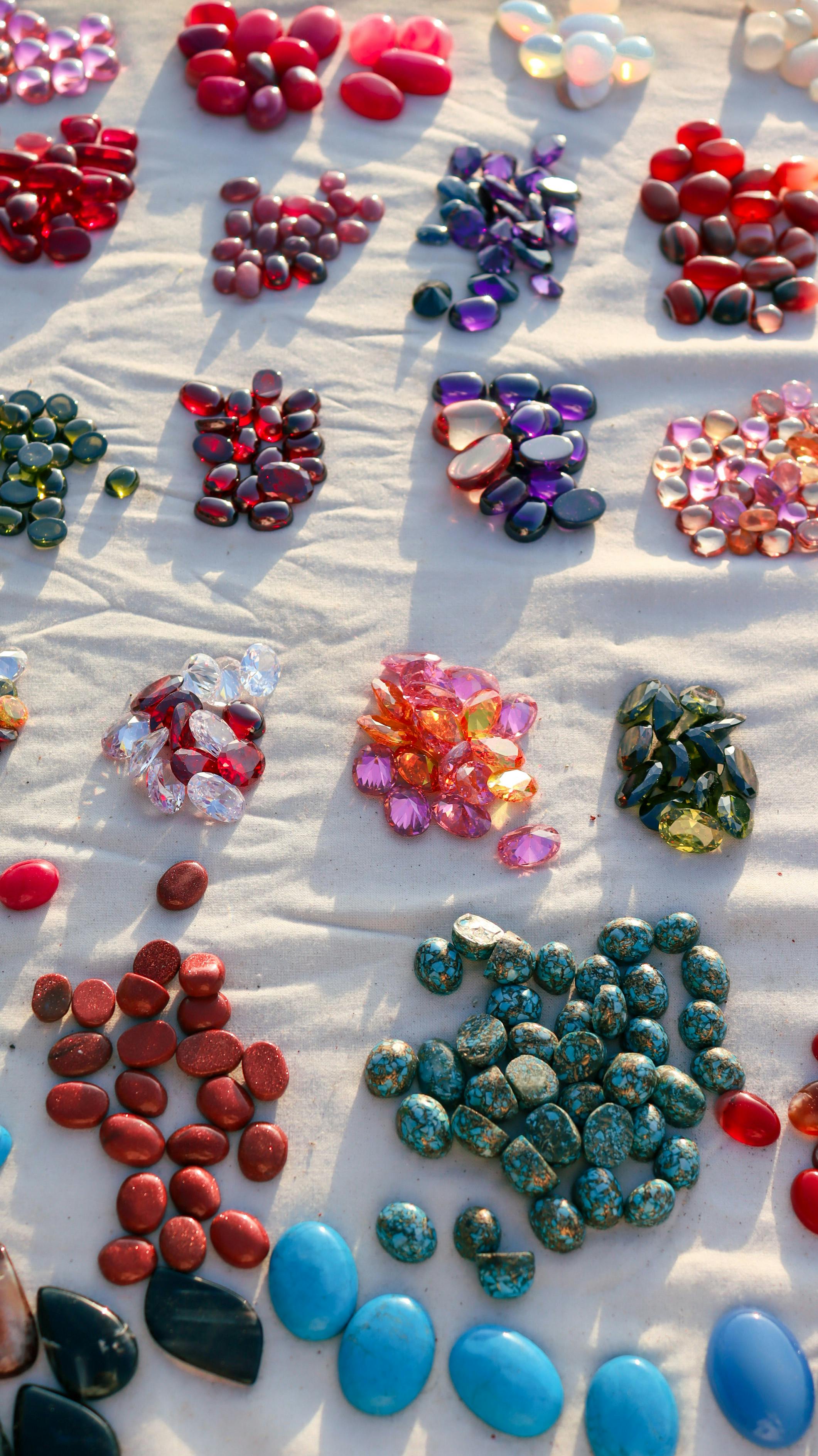 Colorful Pebbles on Sand · Free Stock Photo