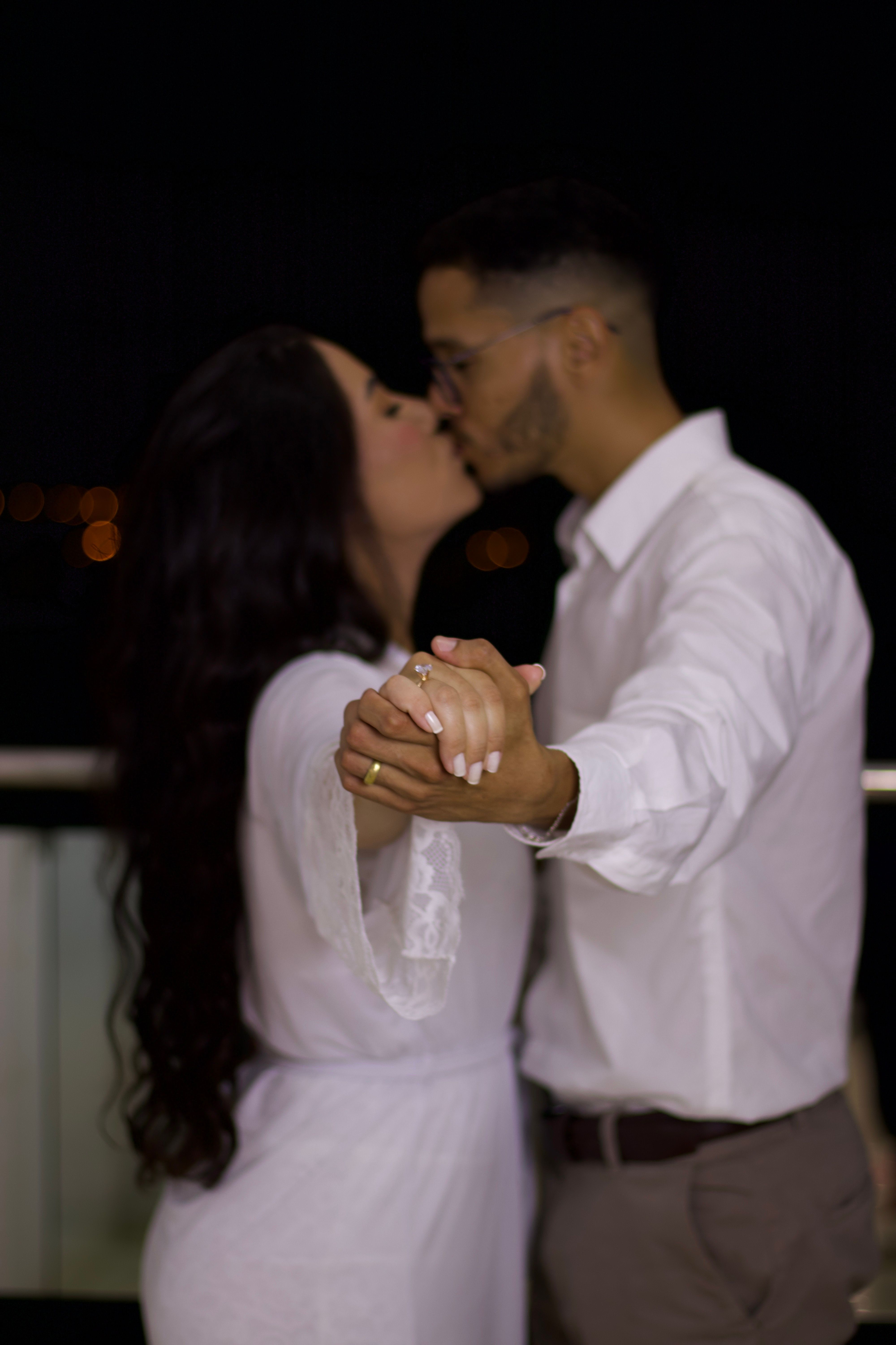 Man and Woman Kissing and Showing Wedding Rings · Free Stock Photo
