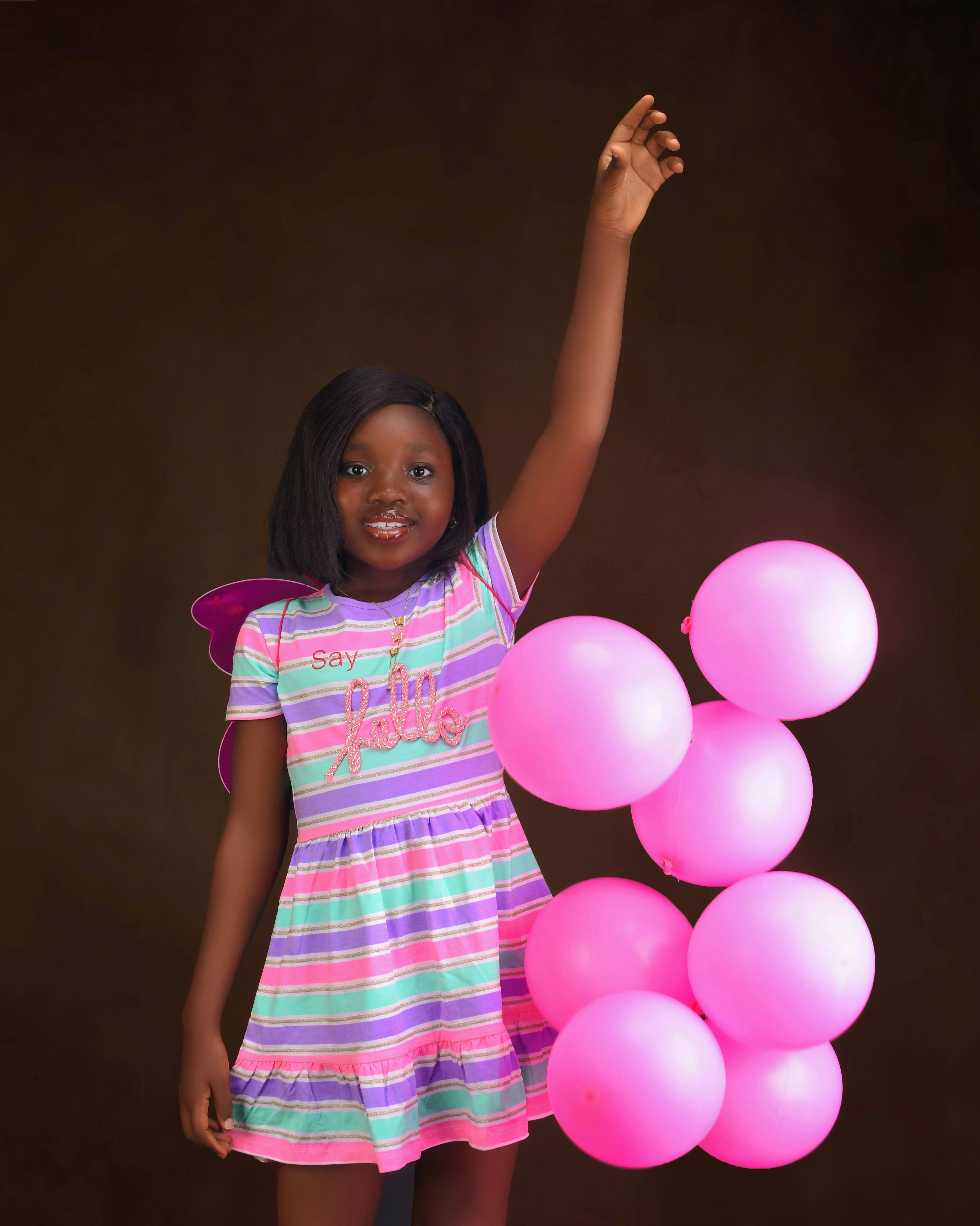 Girl in Dress Standing next to Food Stand at Fair · Free Stock Photo