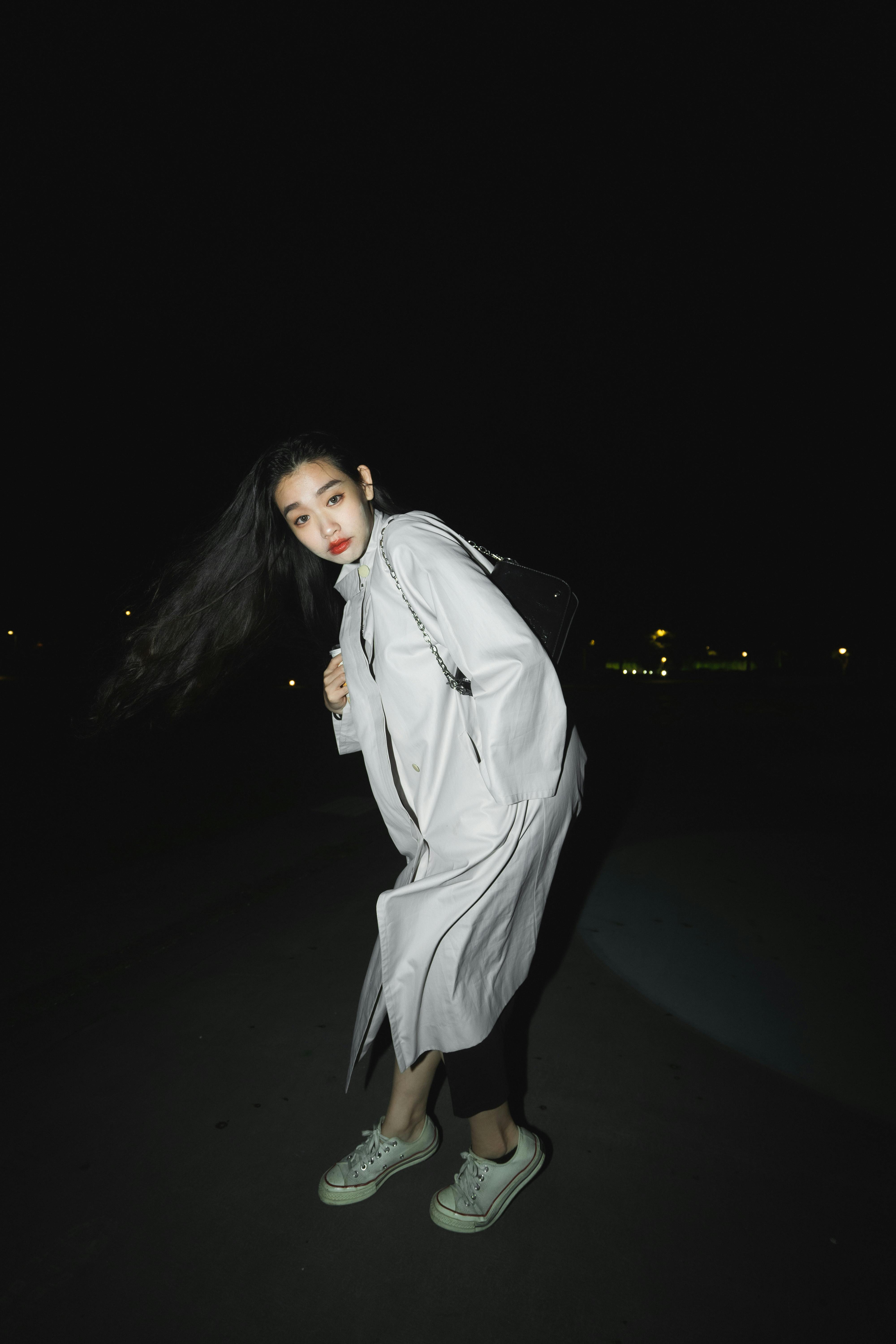 Woman Posing in Black Coat · Free Stock Photo