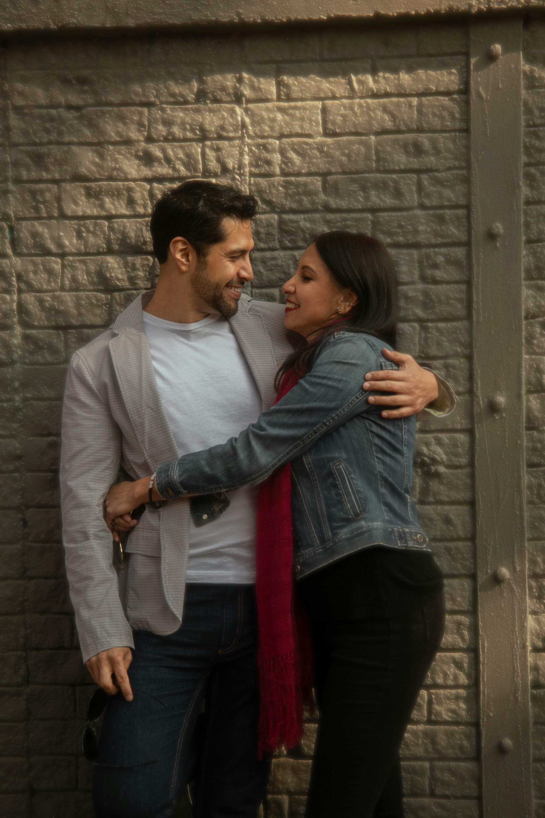 Couple Hugging in Front of a House · Free Stock Photo