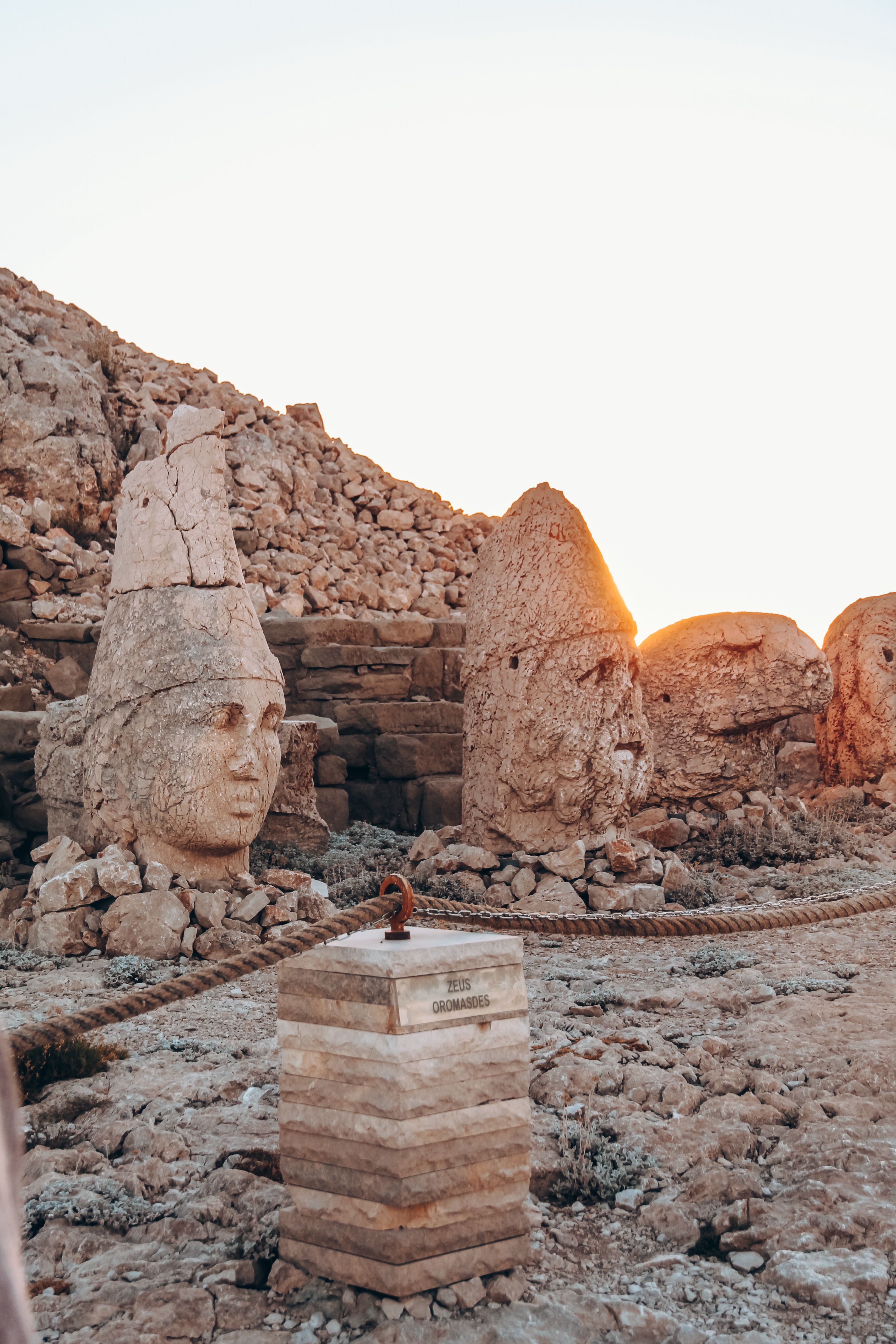 Row of Faces Sculpted in Stone · Free Stock Photo